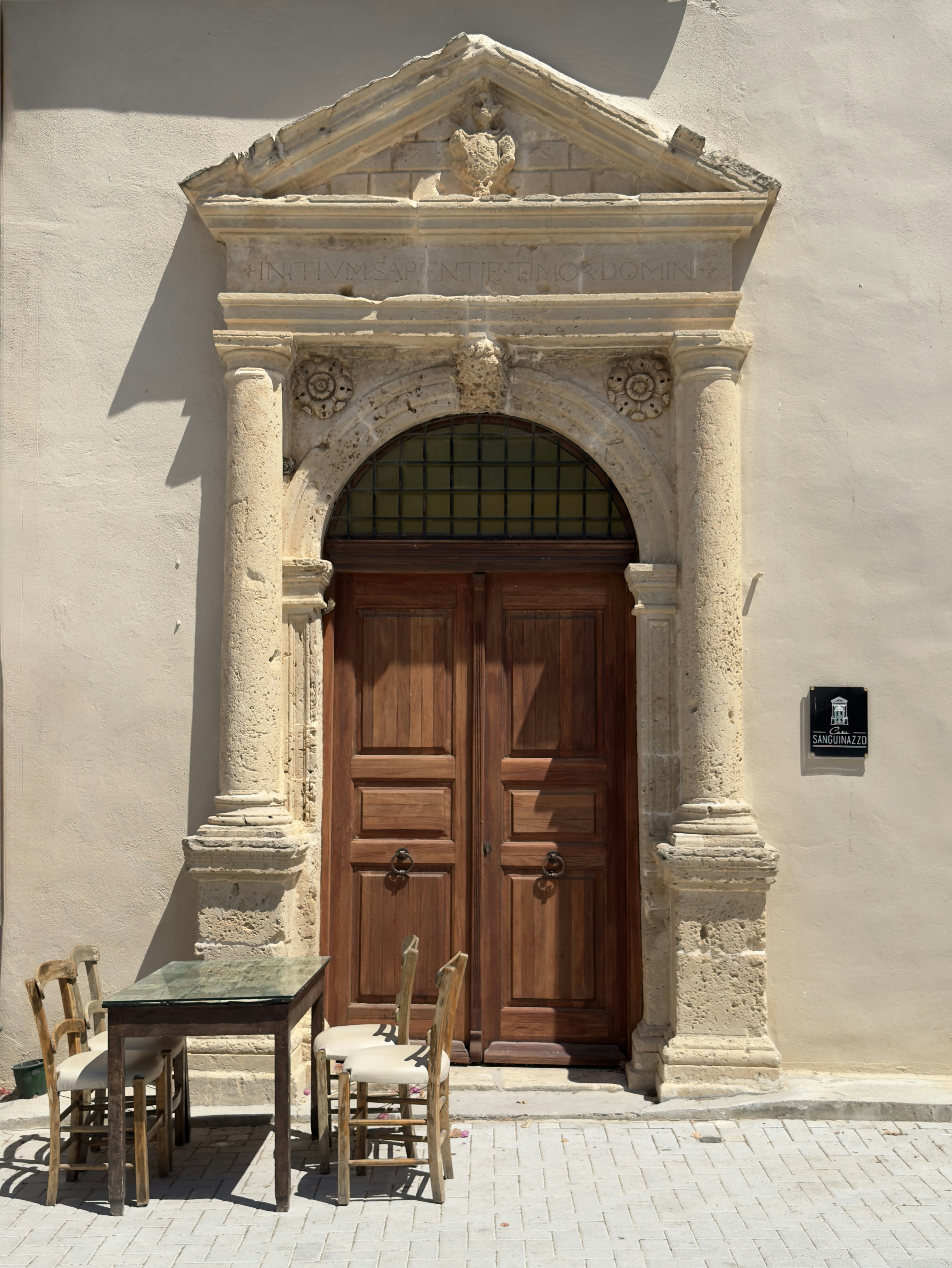 Stone Portal with Weathered Doorway and Outdoor Seating