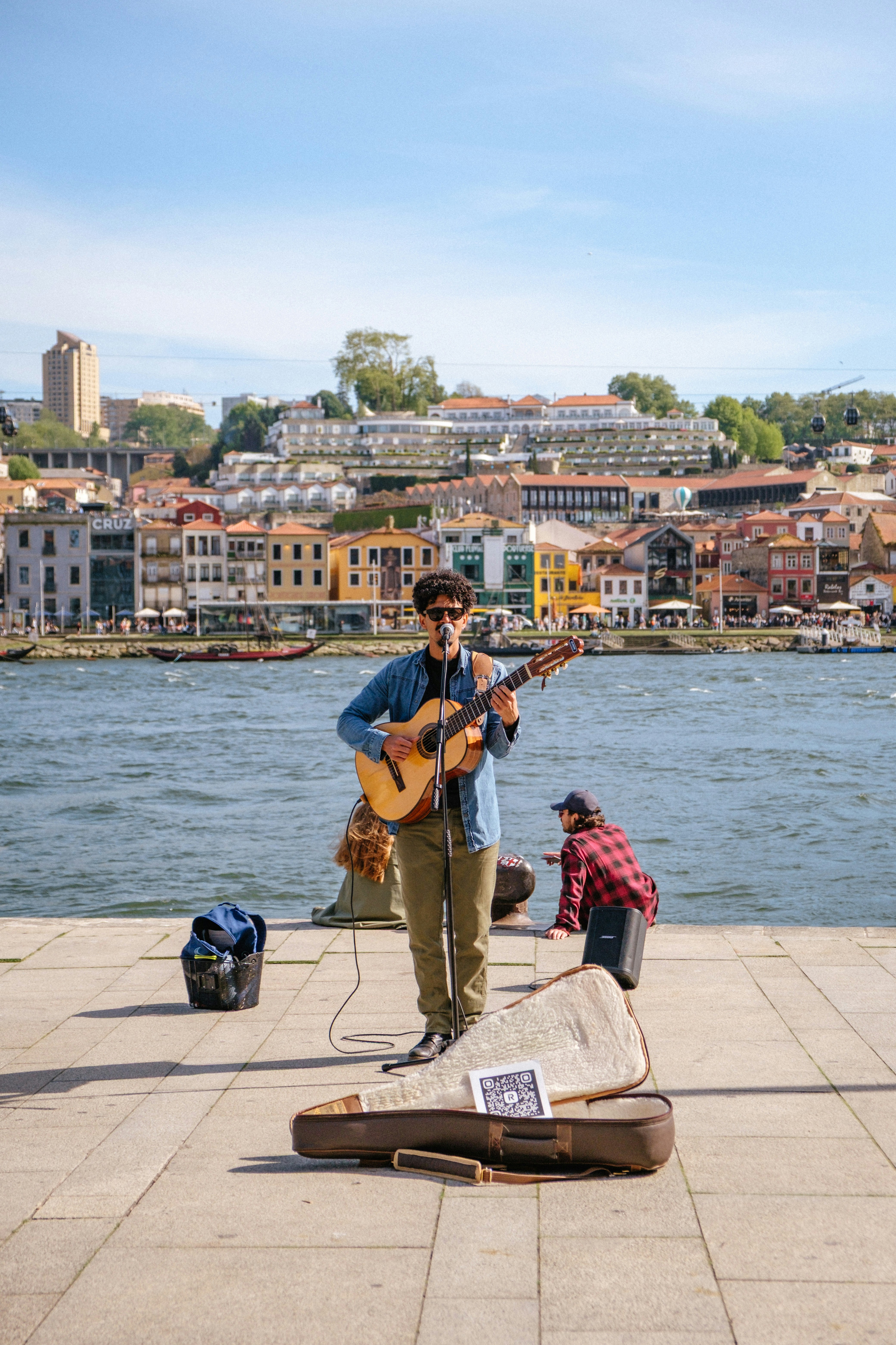 Busker by the River: Acoustic Portrait of a Street Performer