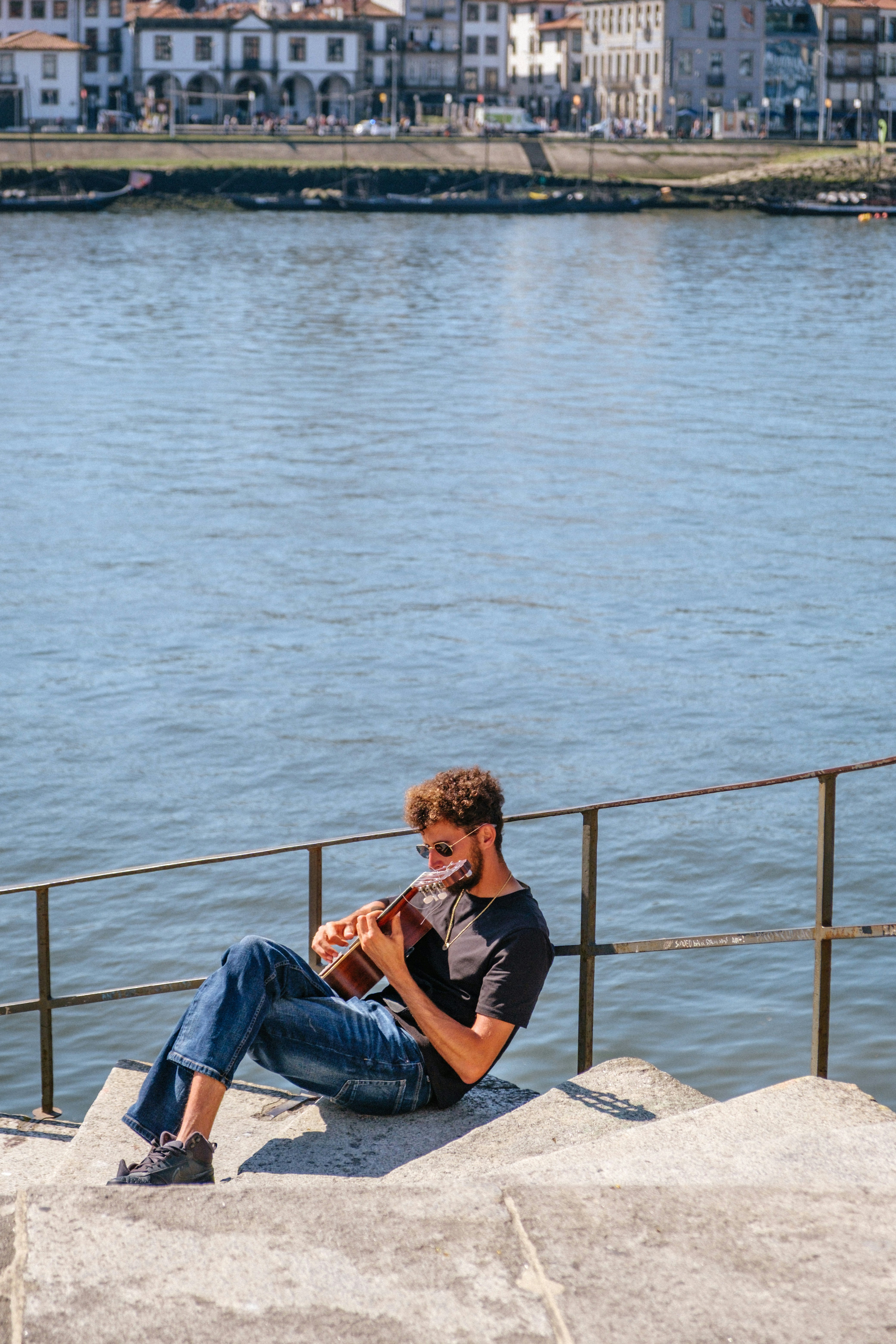 Seaside Promenade: A Quiet Moment with a Guitar on the Pier
