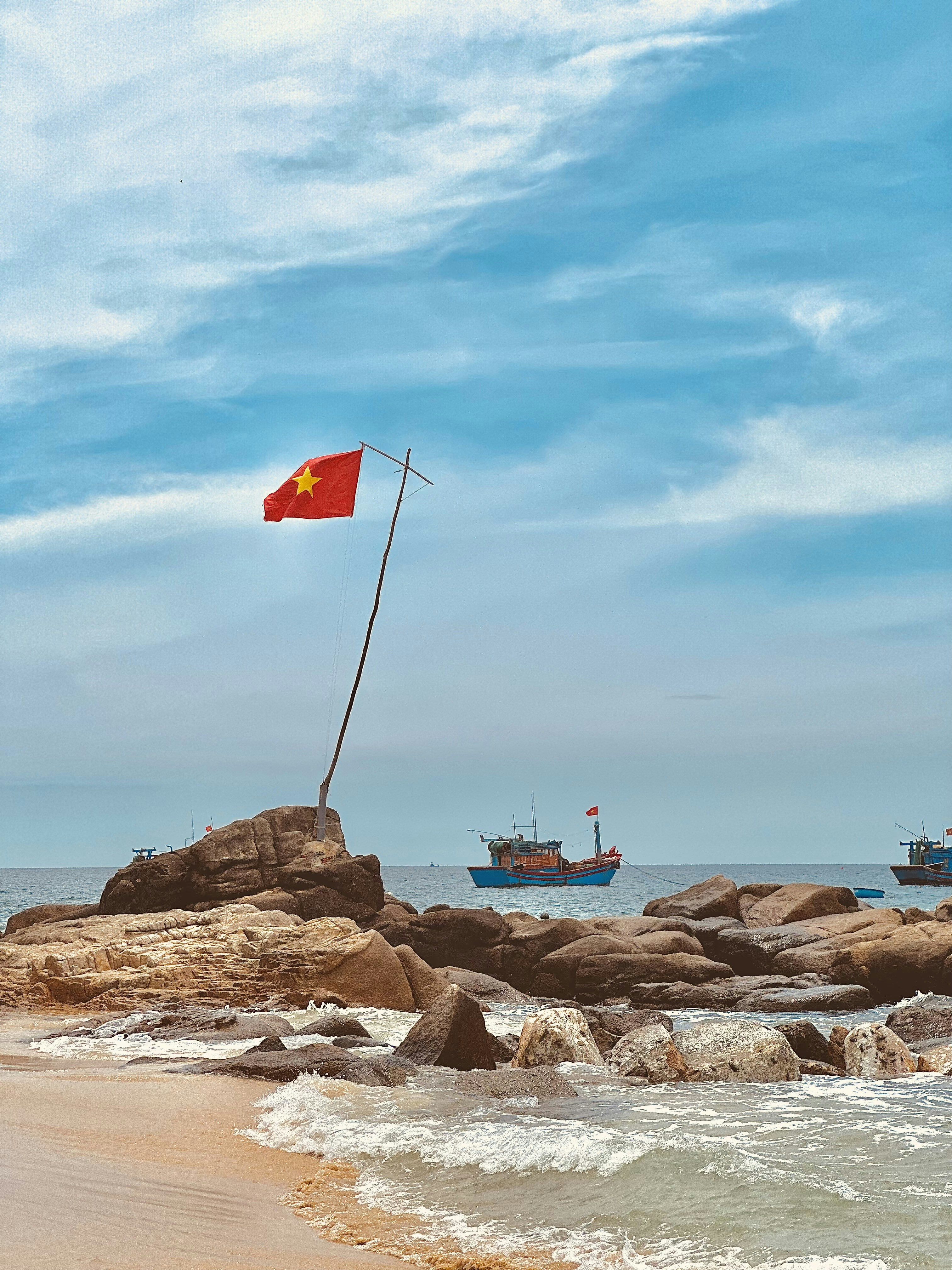 Flag on a Slanted Mast: Quiet Sea and Rock Walk