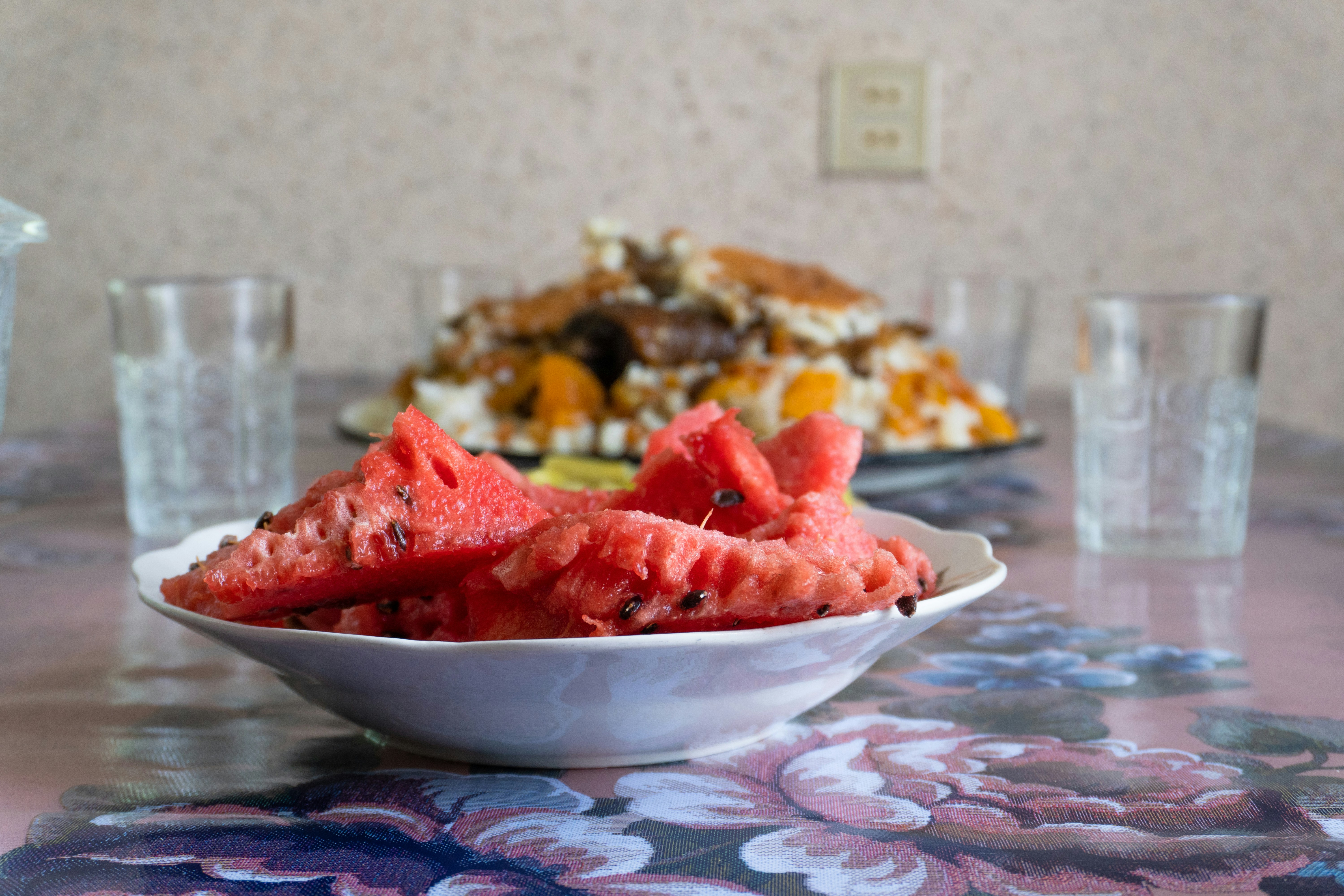 Slice of Summer: Fresh Watermelon Tumbles onto a Table of Treats