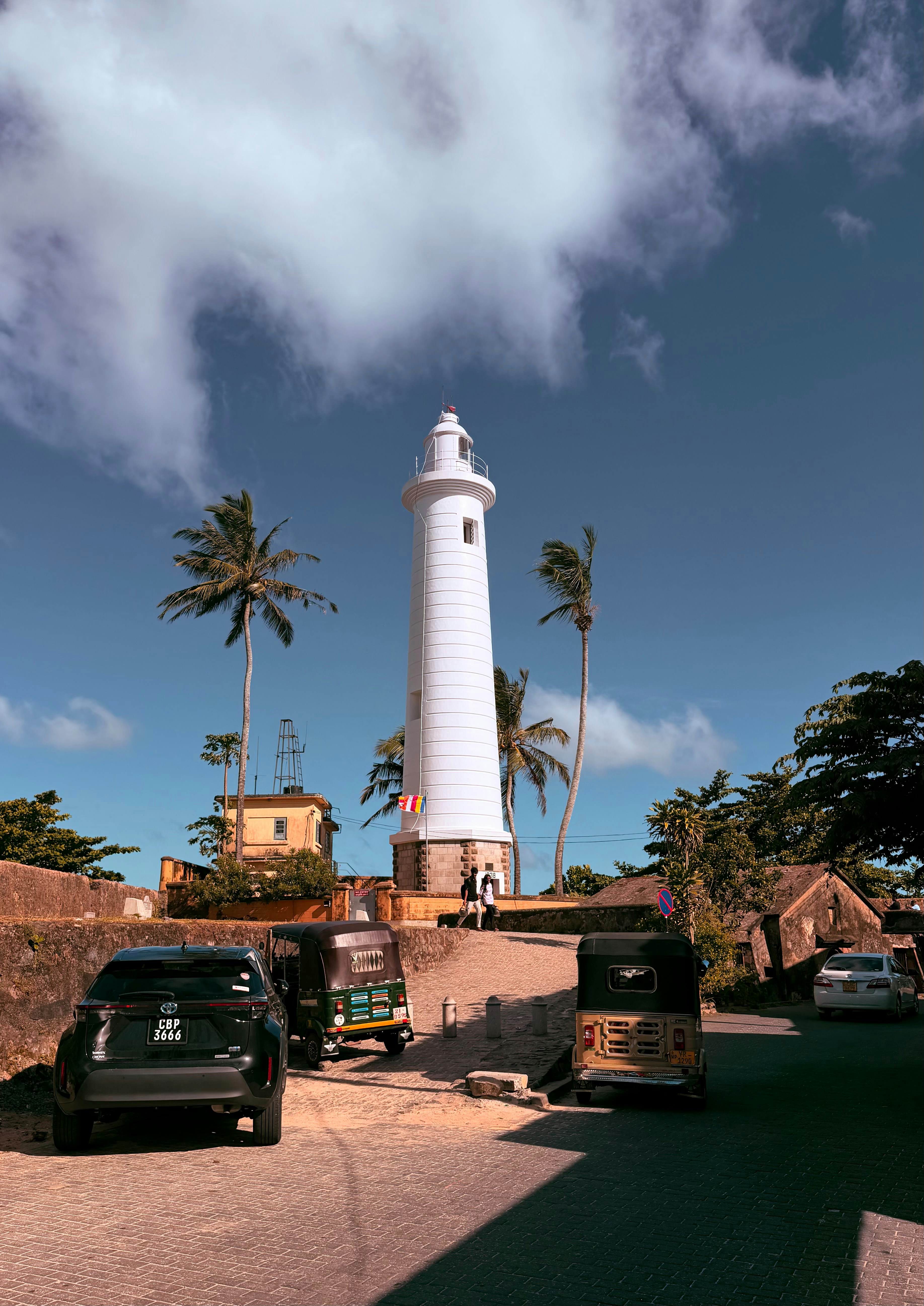 Lighthouse Sentinel Overlooking the Village Path