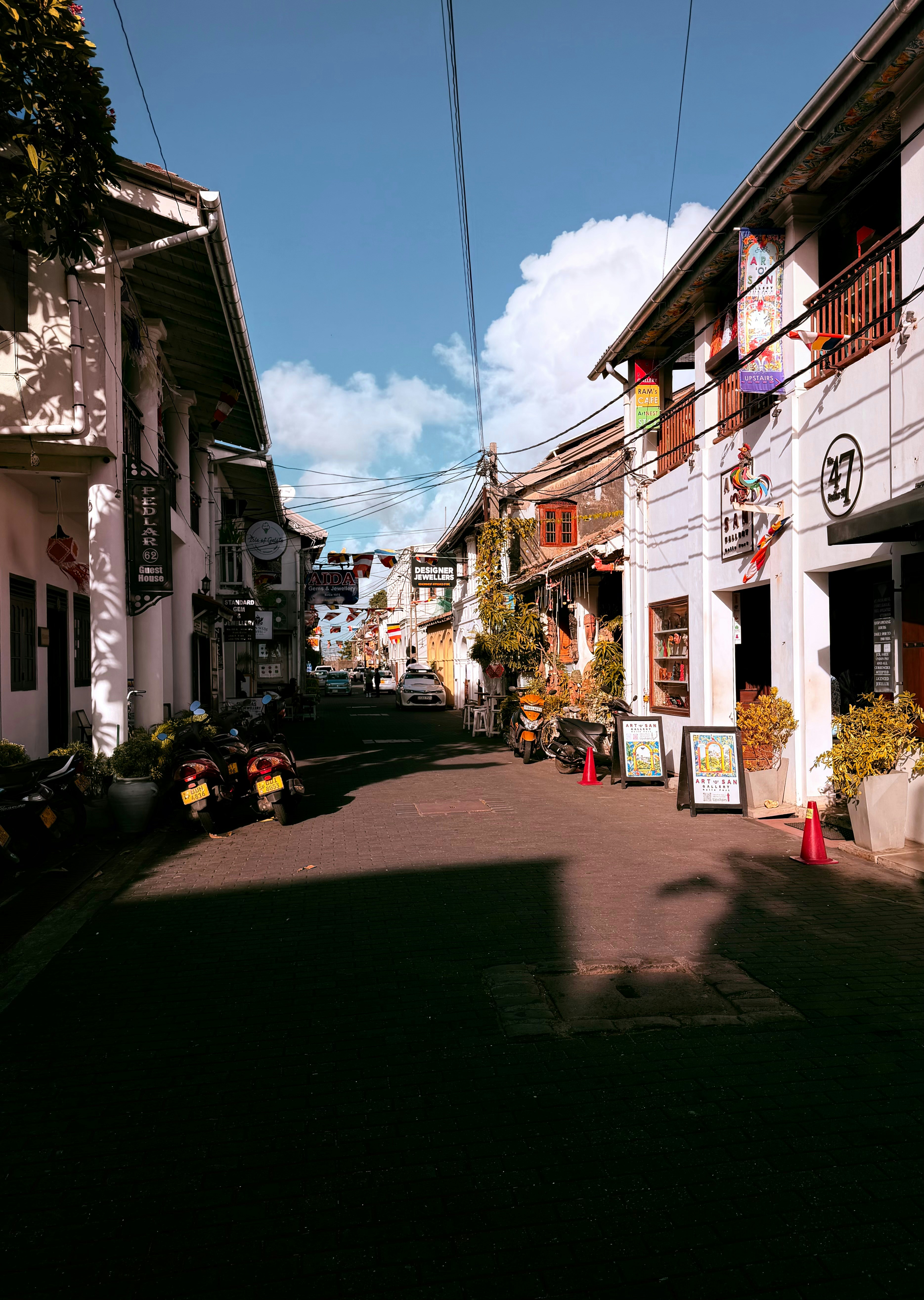 Sunlit Street Between Two Coasts
