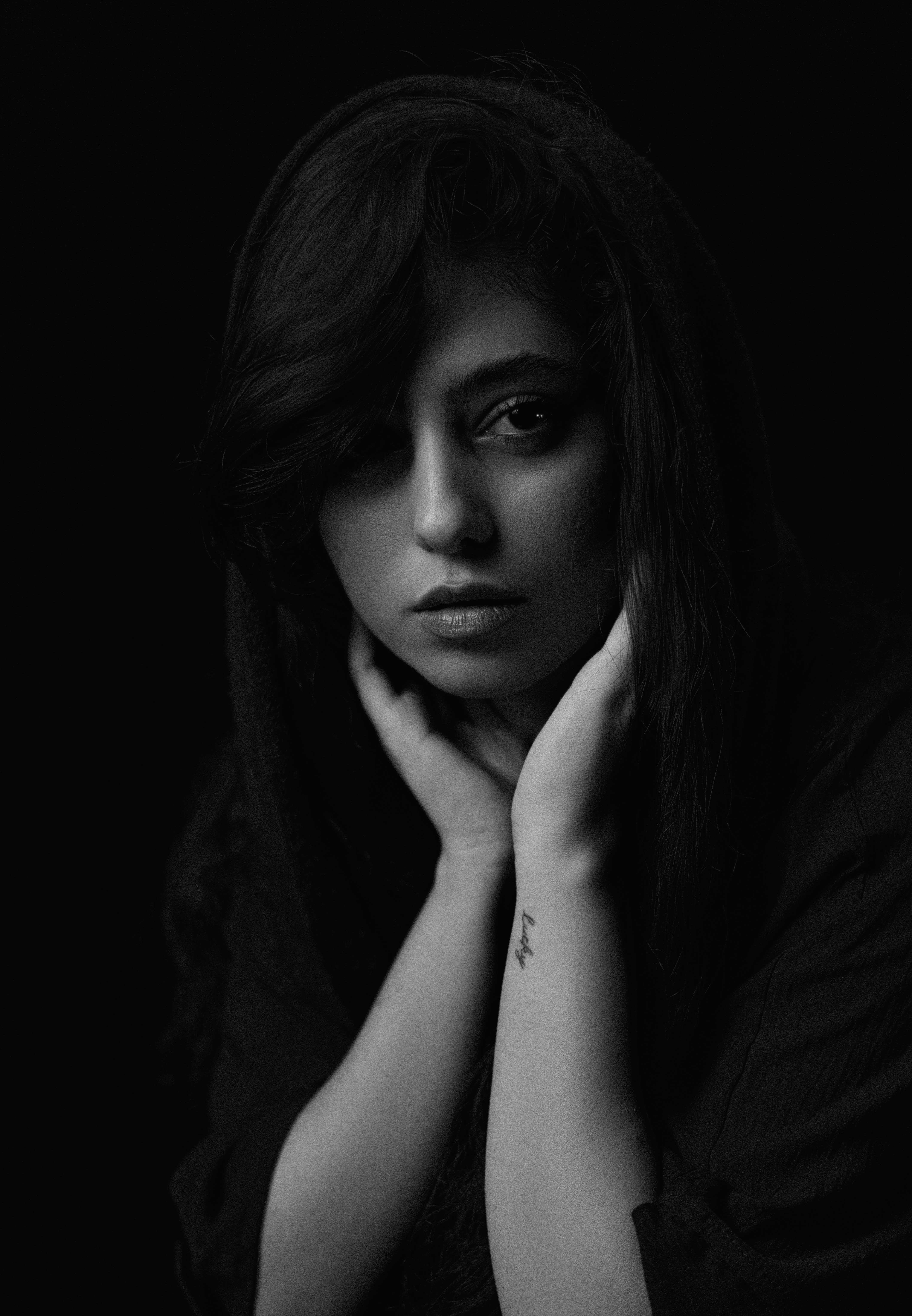 Shadowed Intimacy: A Softly Lit Portrait in Monochrome