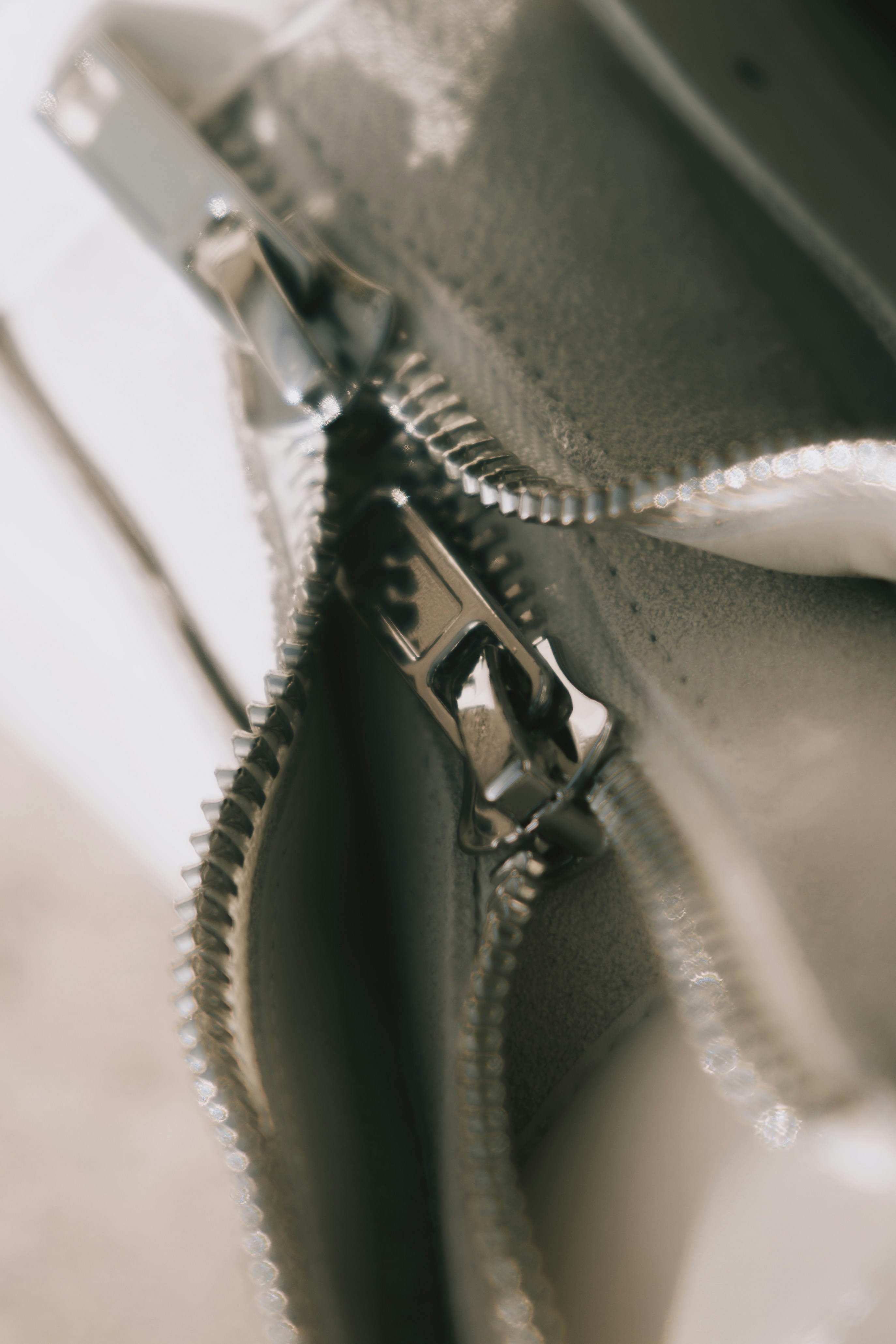 Close-Qued Zipper: Metallic Teeth and Fabric Convergence