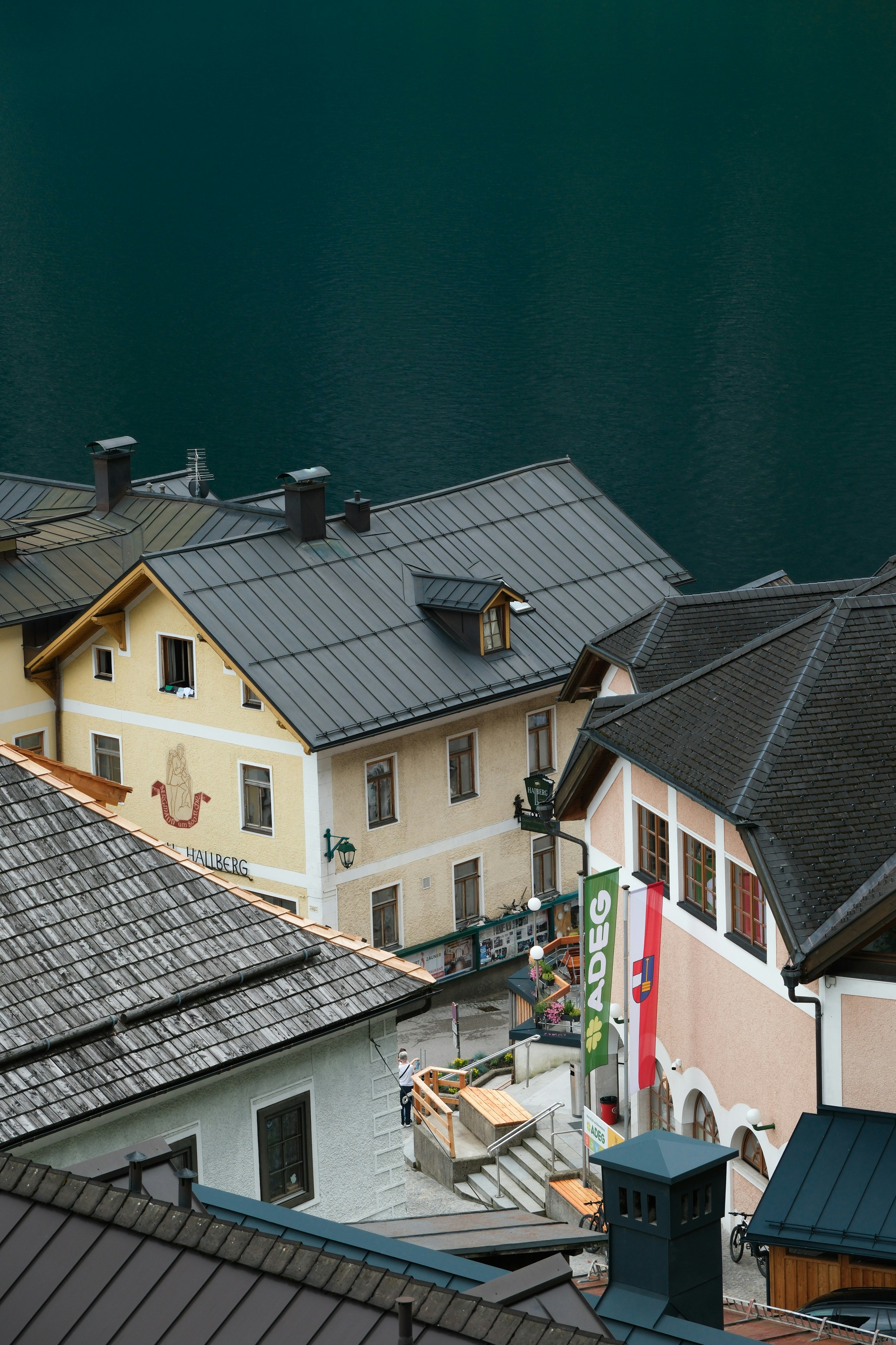 Colorful Alpine Street Descends Toward a Quiet Fjord