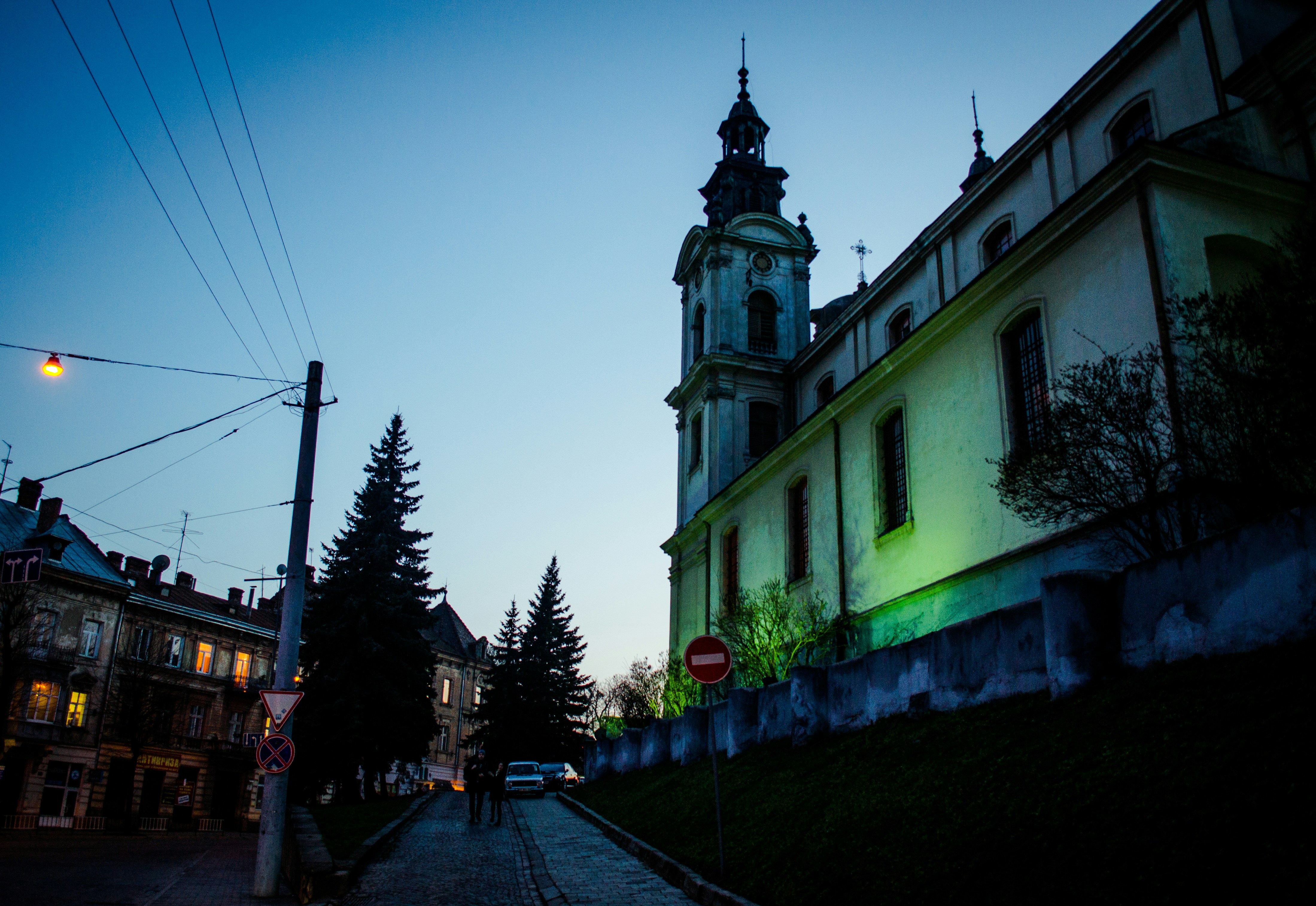 Echoes of a Greened Facade Over a Quiet Evening Street