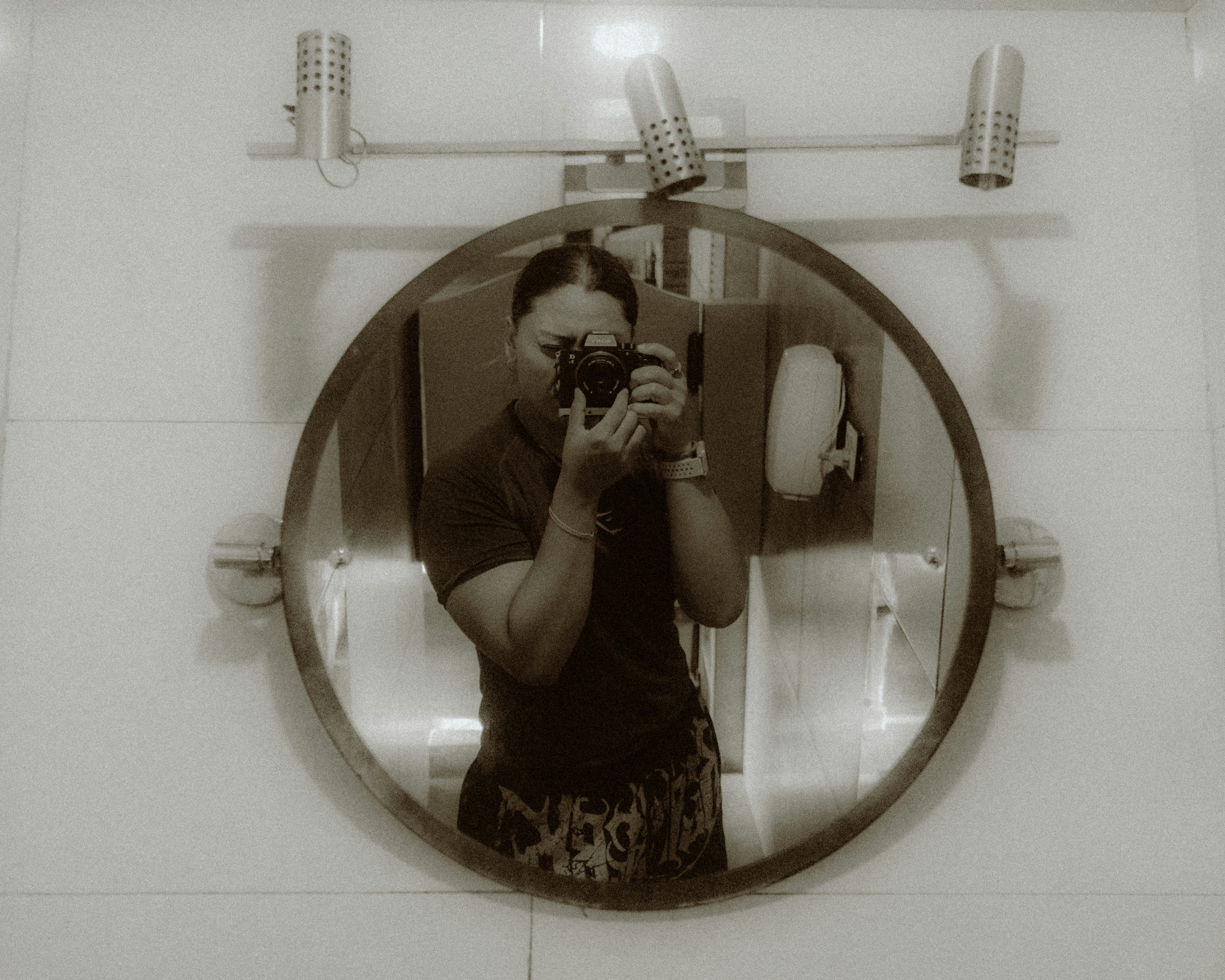 Mirror Portrait: Reflected Snapshot in a Circular Vanity
