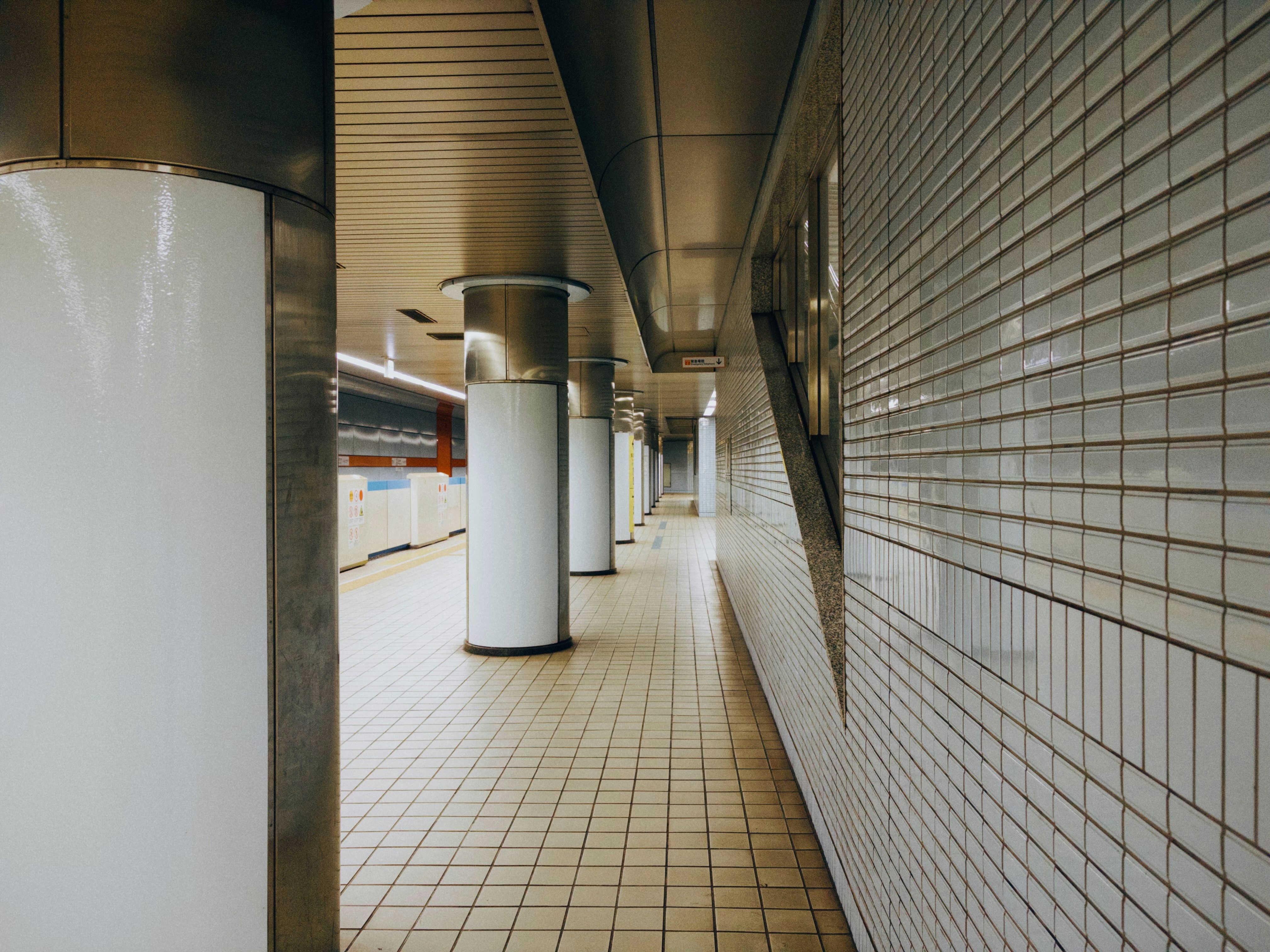 Silent Corridor: Neon Columns in a Subterranean Avenue