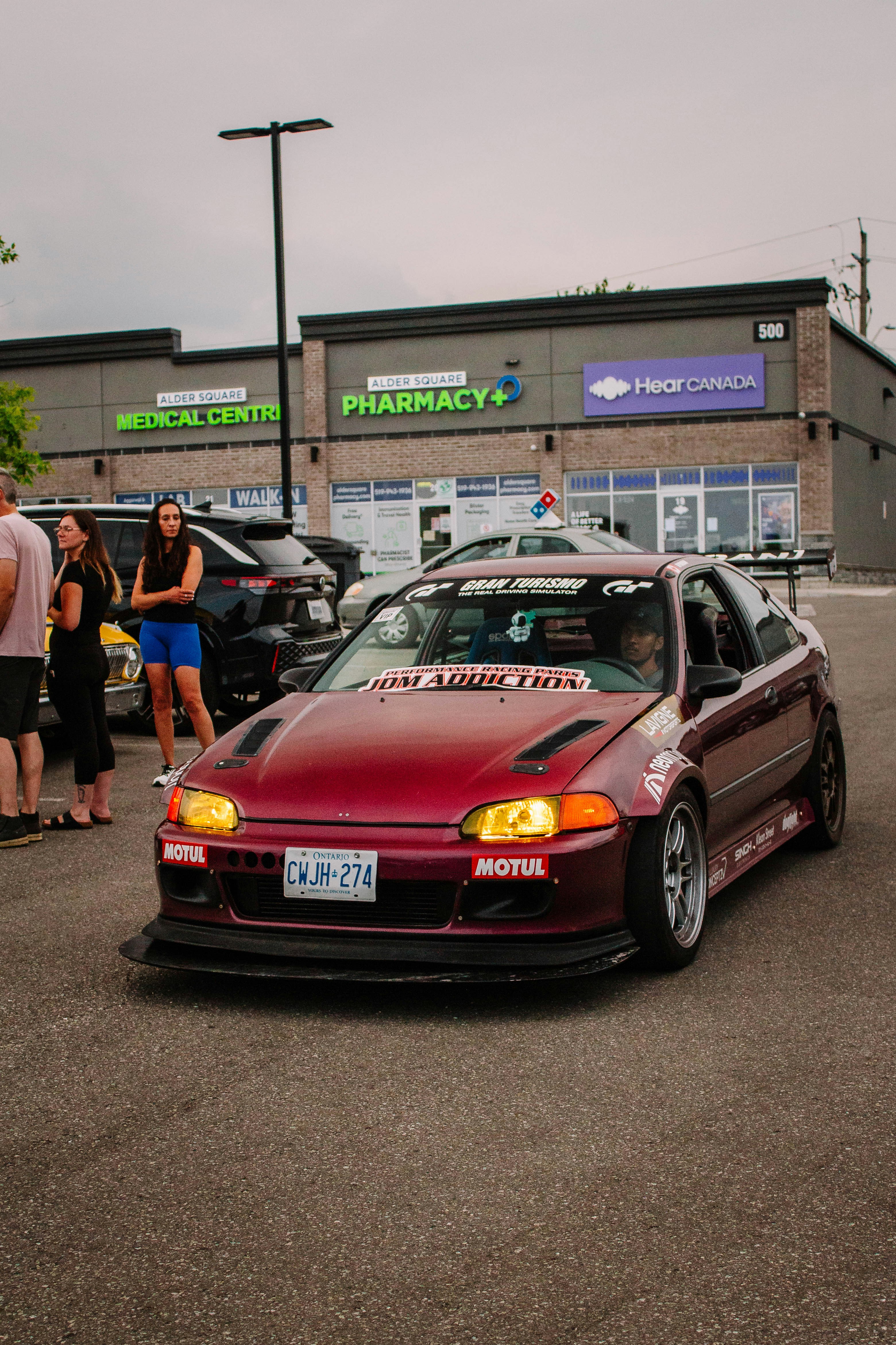 Maroon Drift: A Stance of Street Presence in a Parking Lot