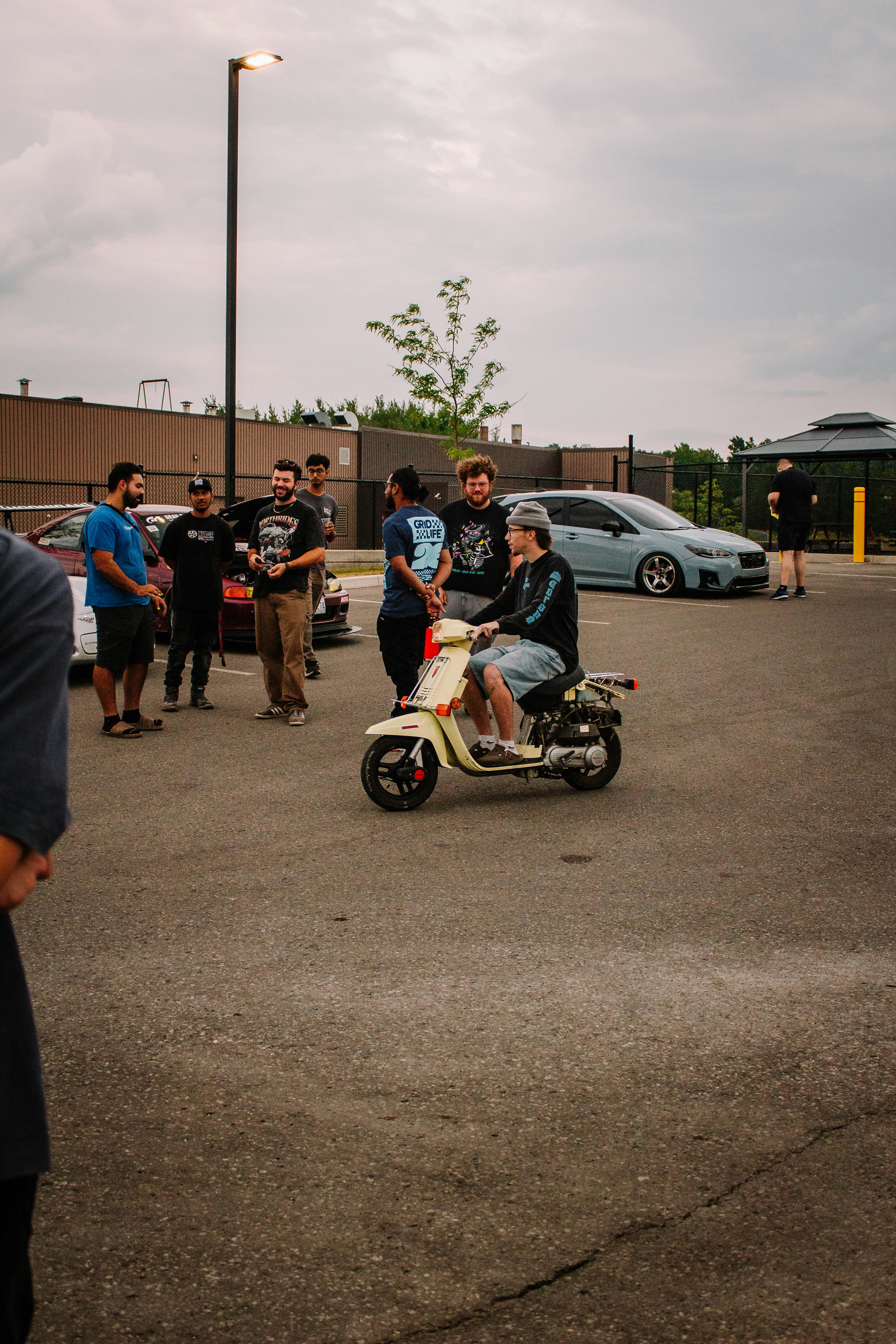 Scooter-side Meeting: A Casual Converation in the Parking Lot