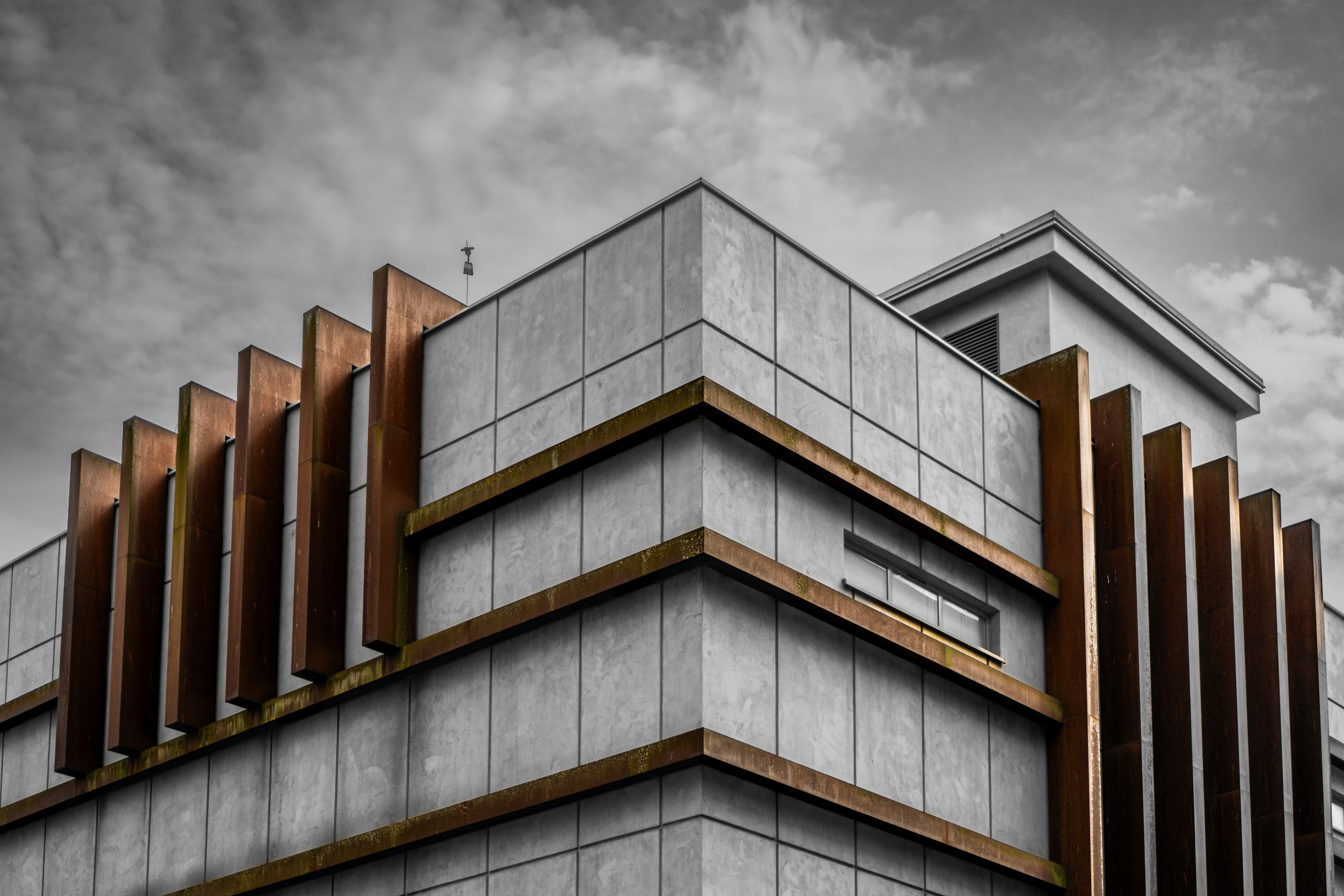 Corner of Concrete and Rust: A Modernist Facade in Monochrome