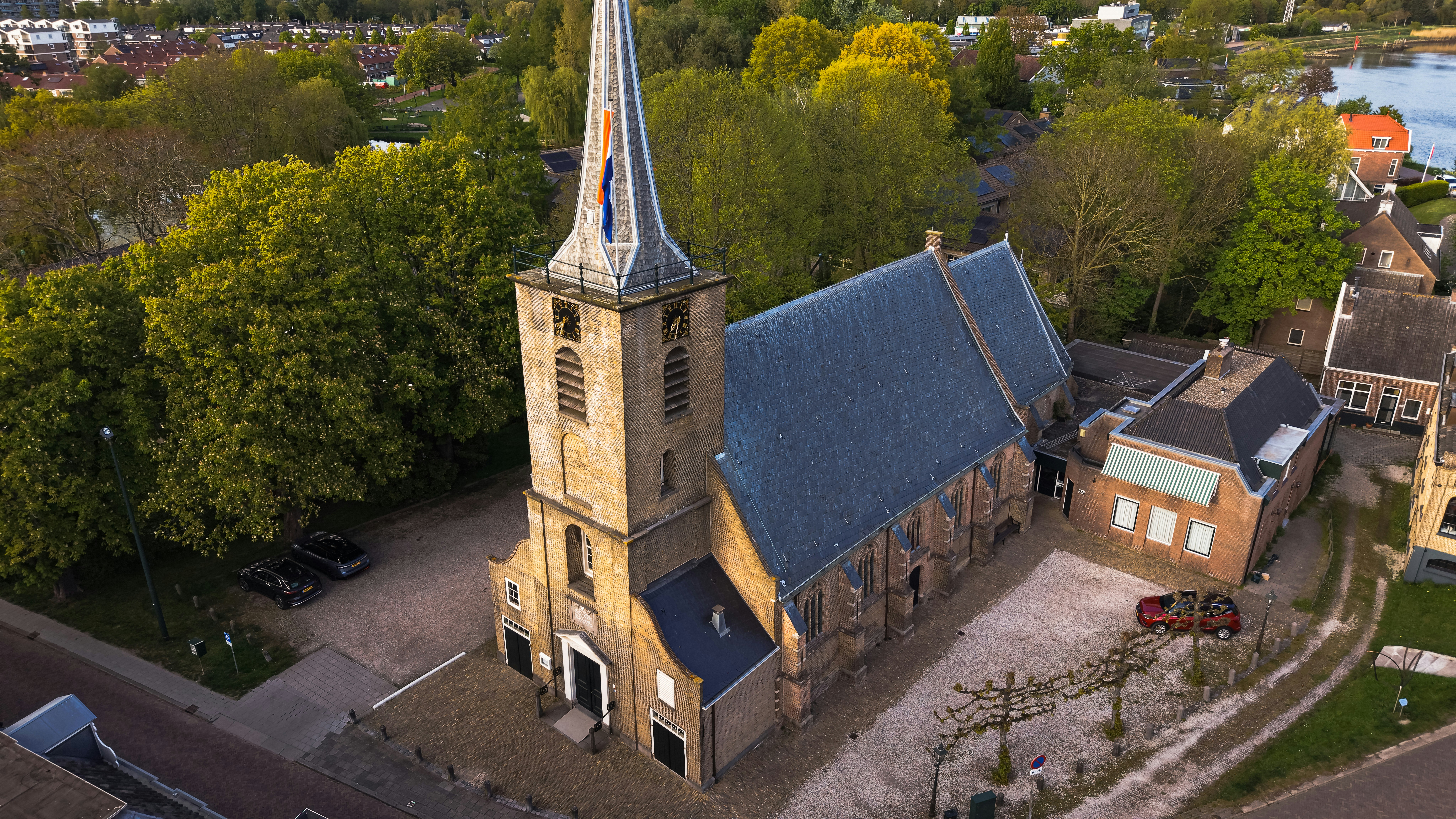 Aerial Hope: The Village Church Crowned by Autumn Canopy