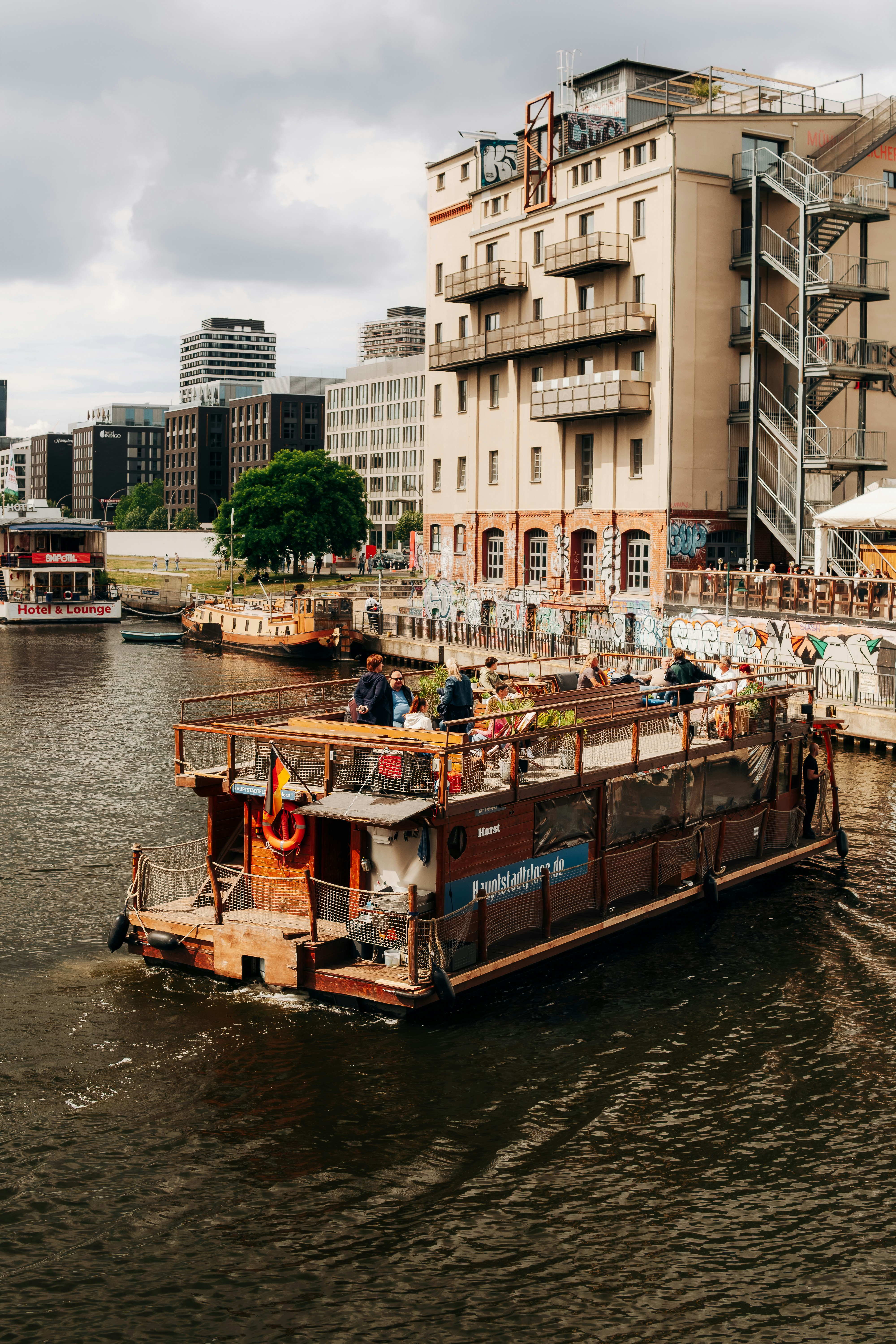 Urban Boat Tour On the River: A Layered Cityscape
