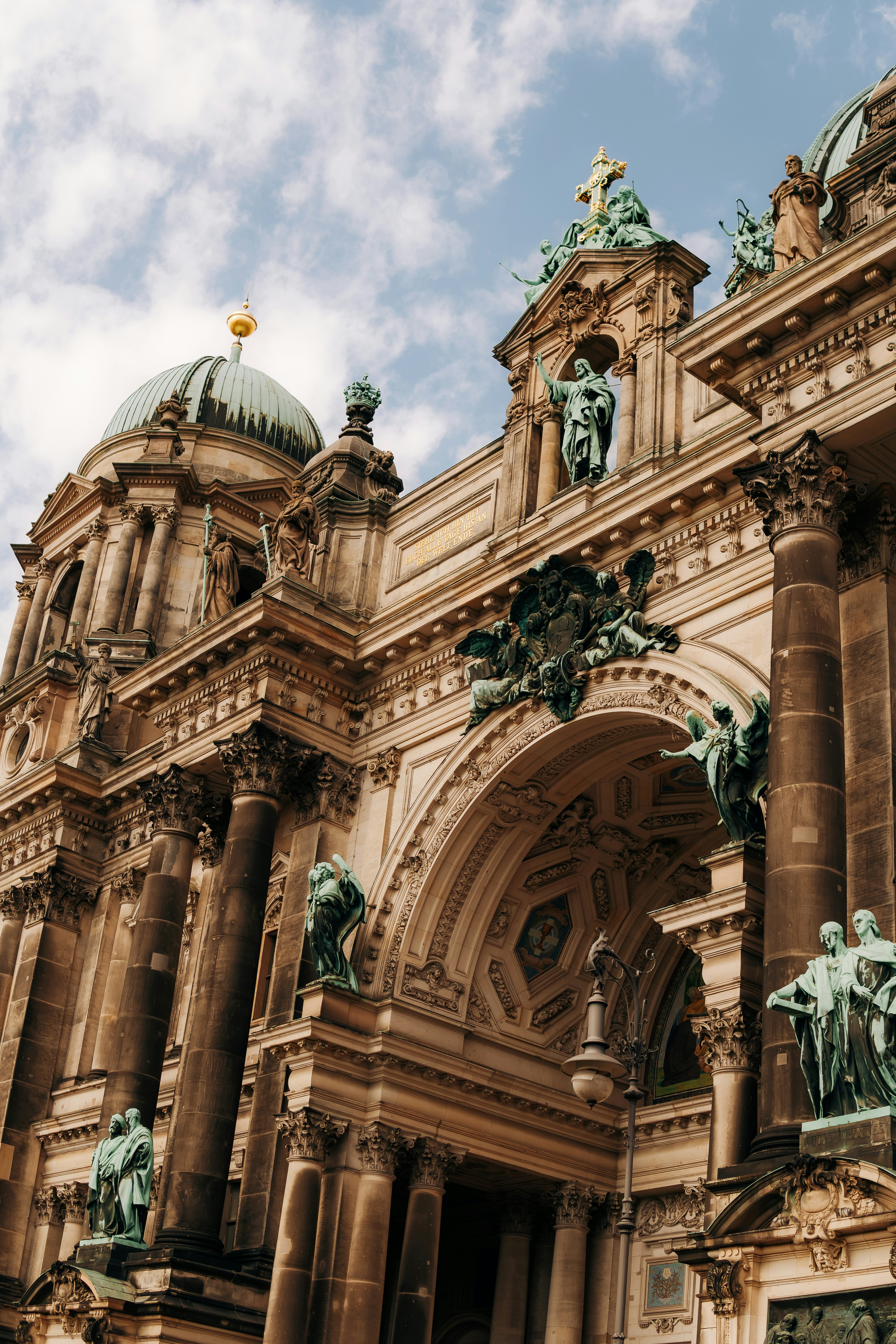 Stone Cathedral Facade: Guardians of the Arch in Bronze and Pillarlight