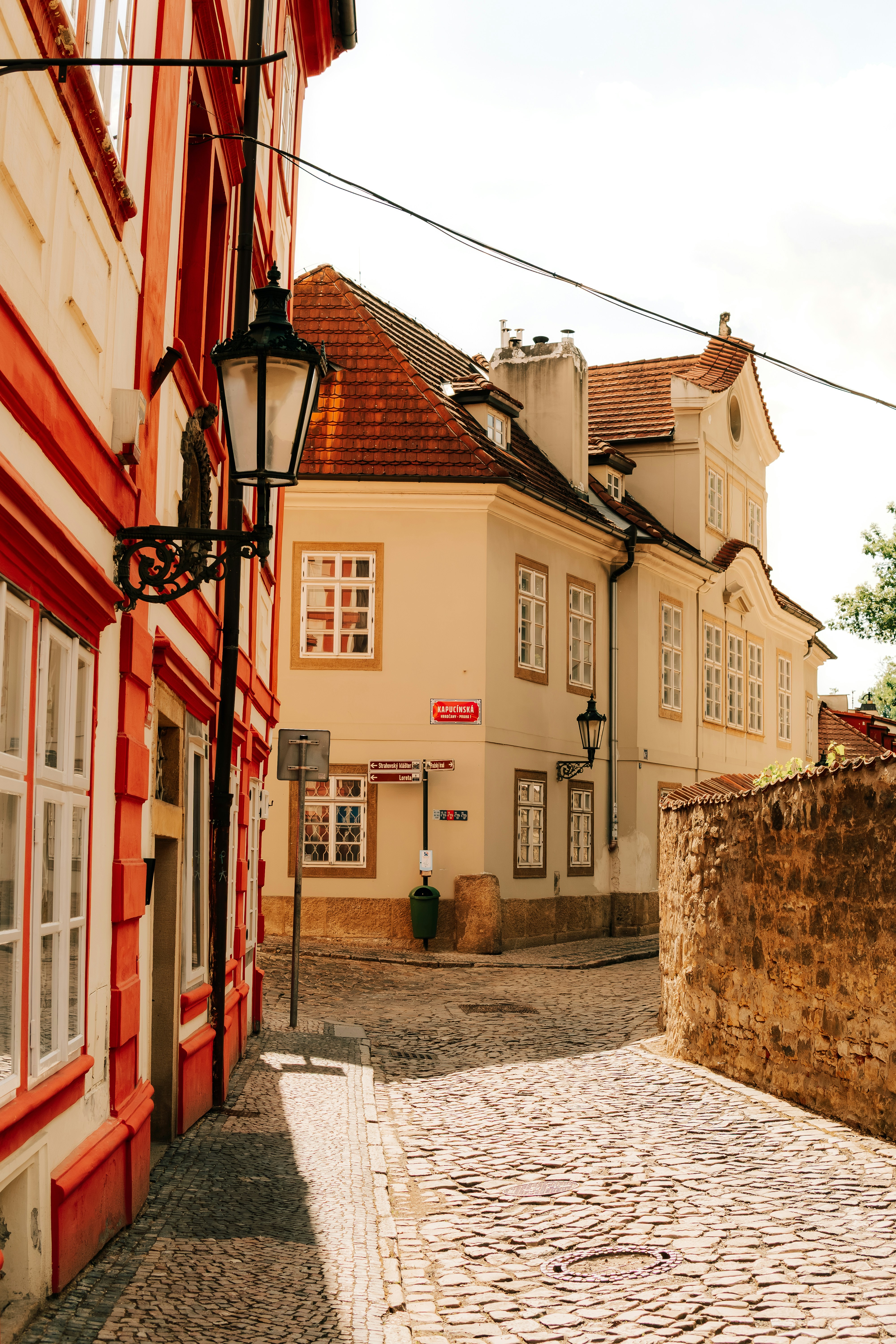 Sunlit Cobblestones and Colorful Facades in a Quiet Old Town