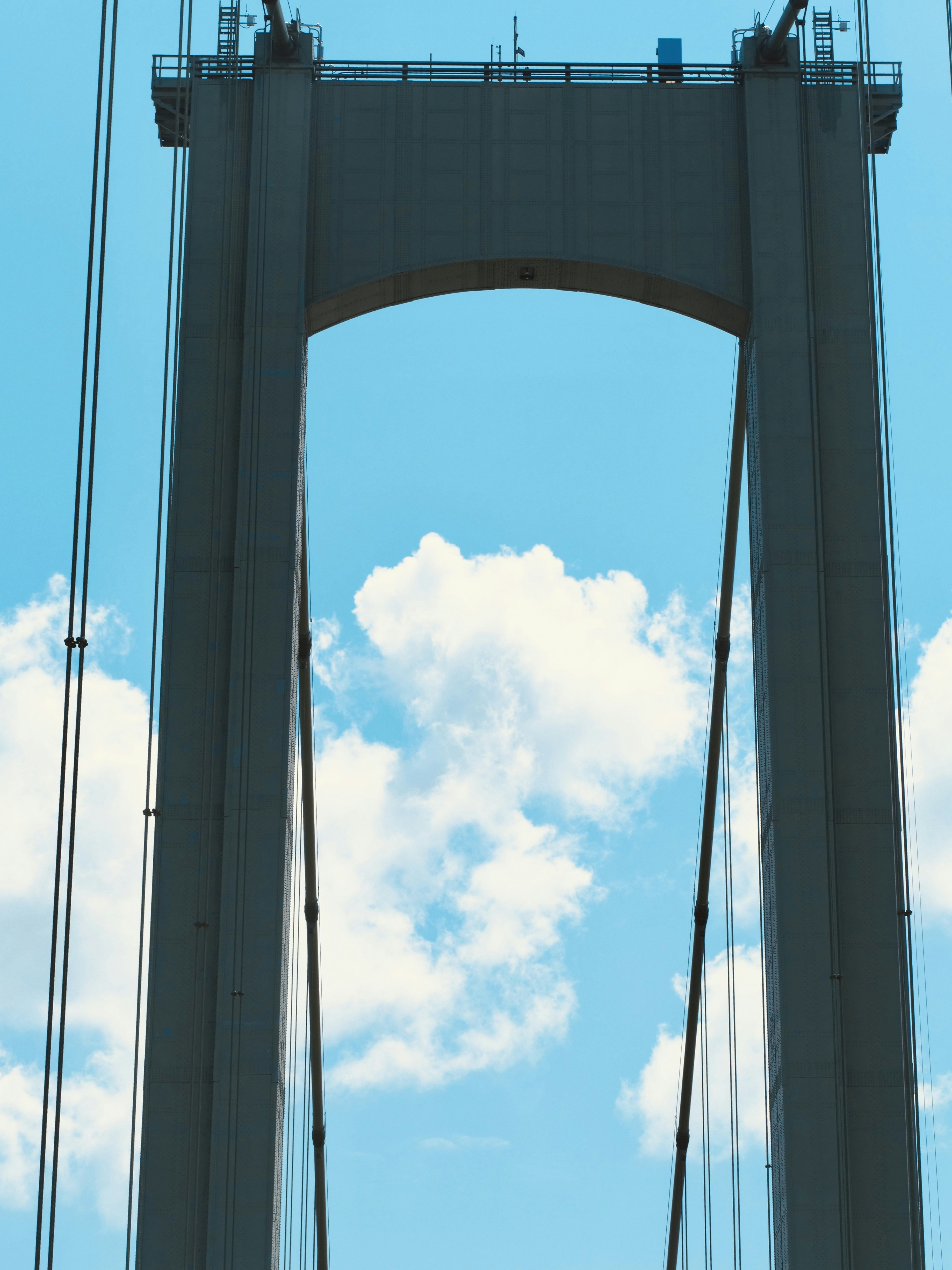 Skyward Arc: The Tower Girders Against a Clear Blue