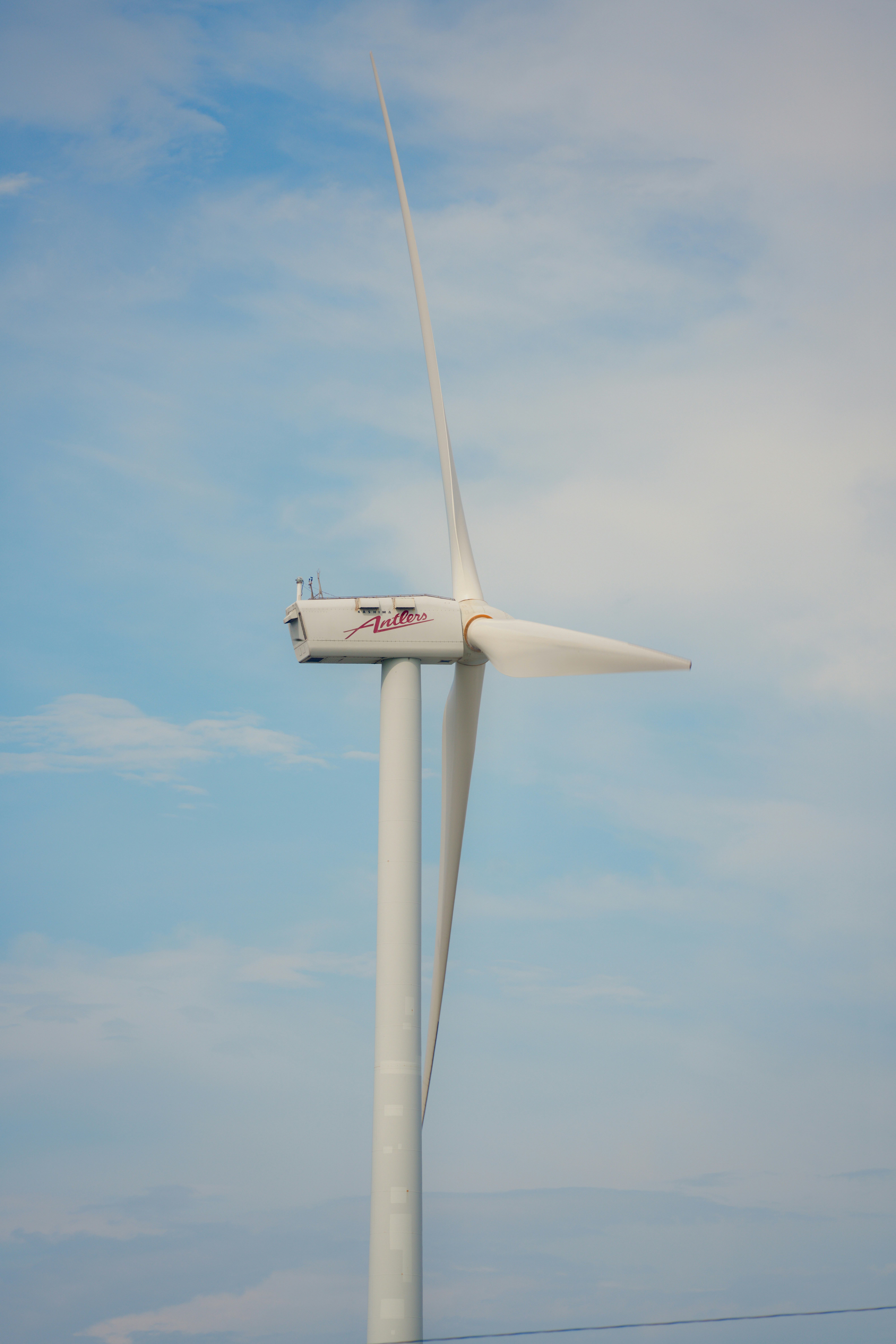 Silent Giant: A Wind Turbine Reaches Toward a Bright Sky