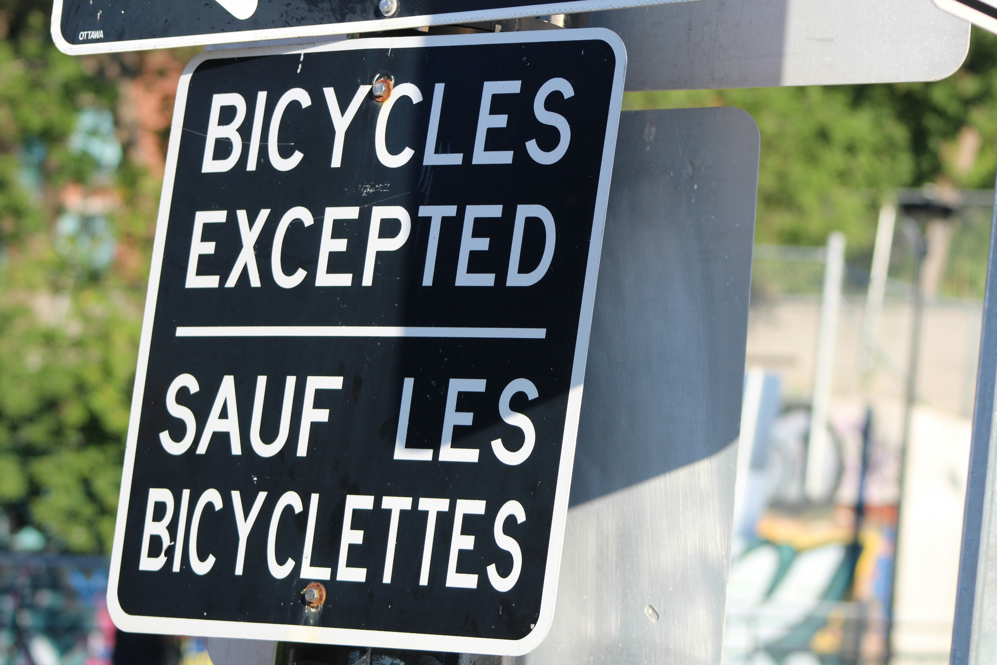 SIGN OF THE DAY: BICYCLES EXCEPTED in bold white text