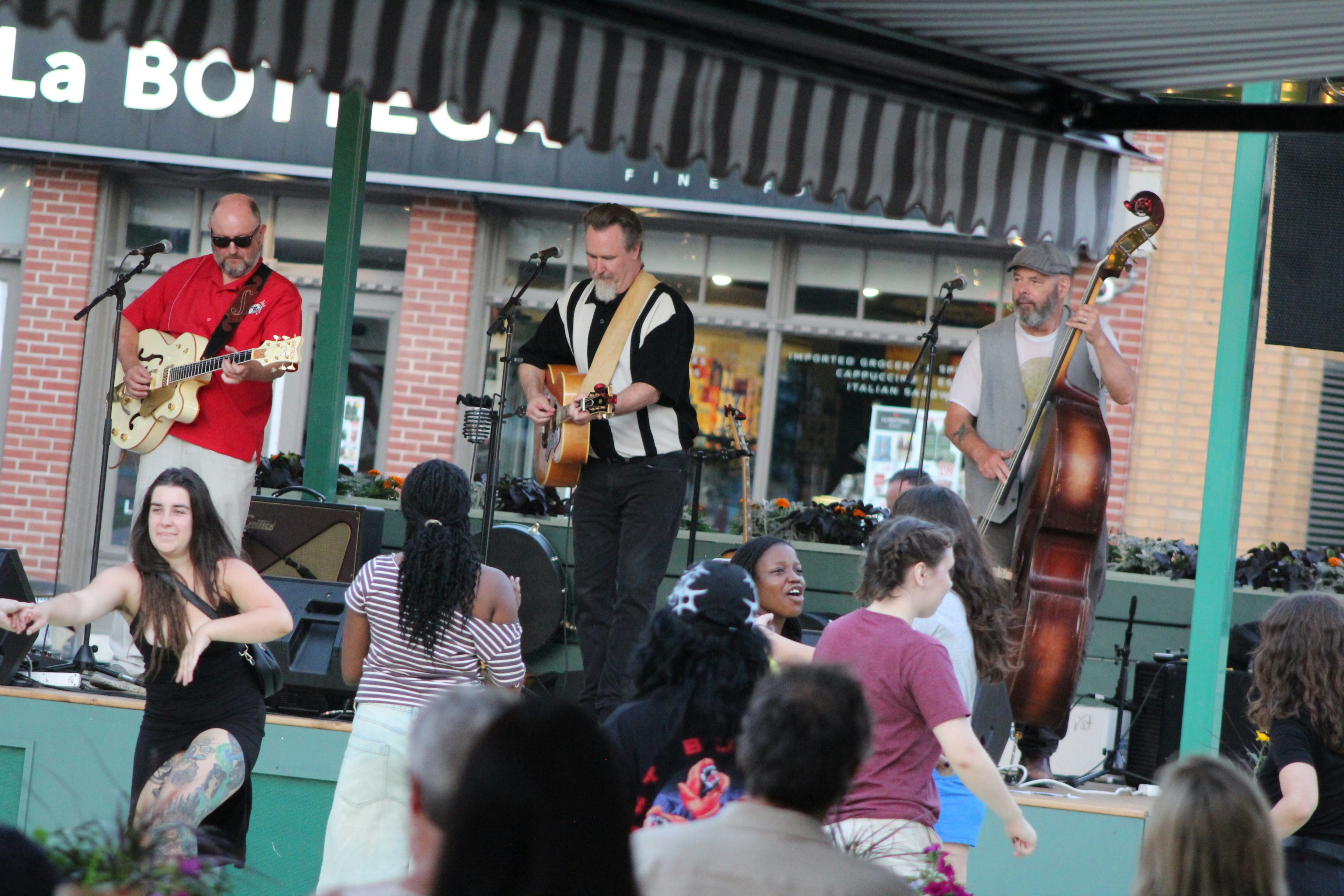 Bright Street Serenade: A Trio of Musicians Energizes an Outdoor Crowd