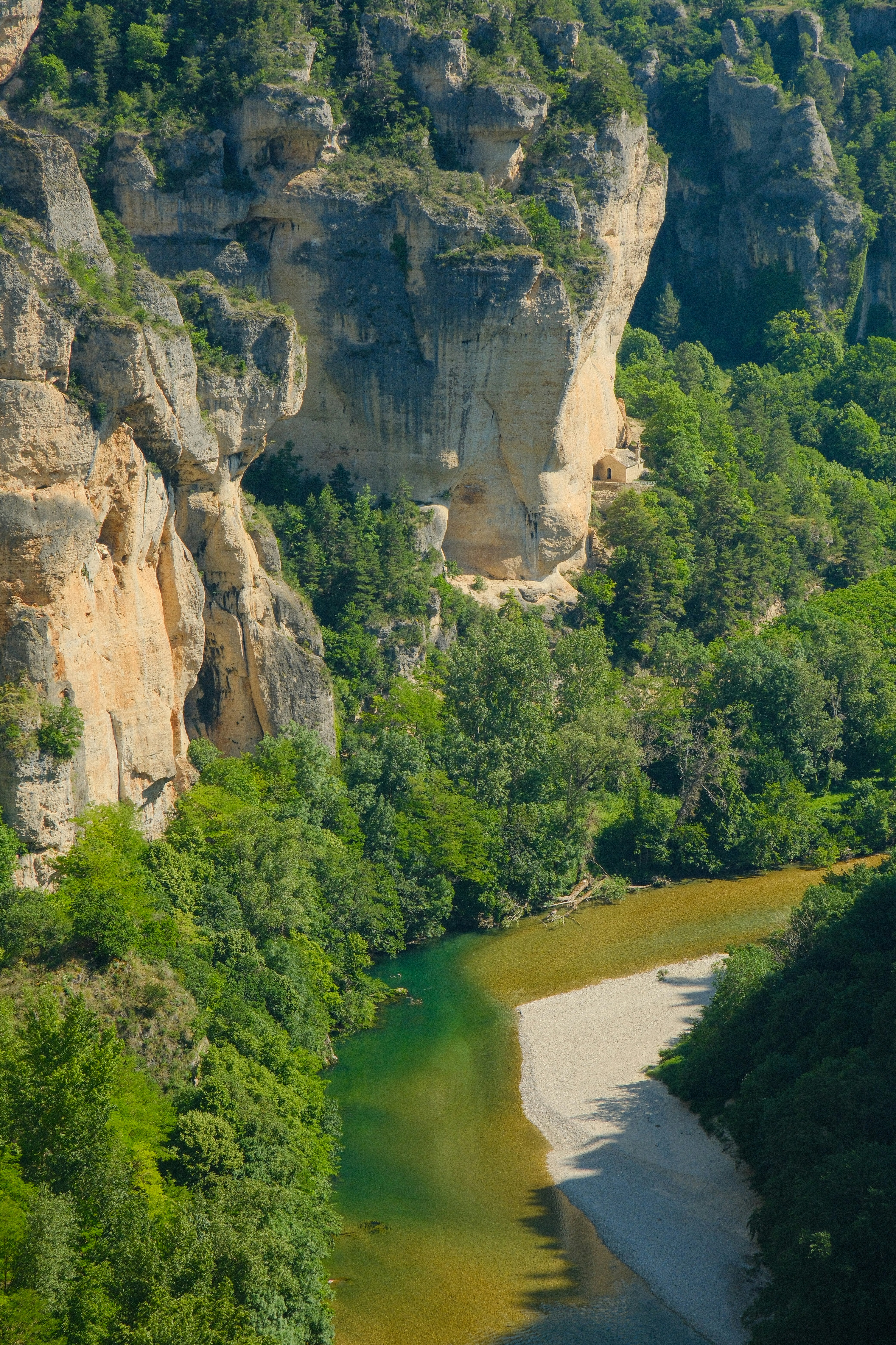Hidden Gorge Amid Carved Cliffs and Green River Bend