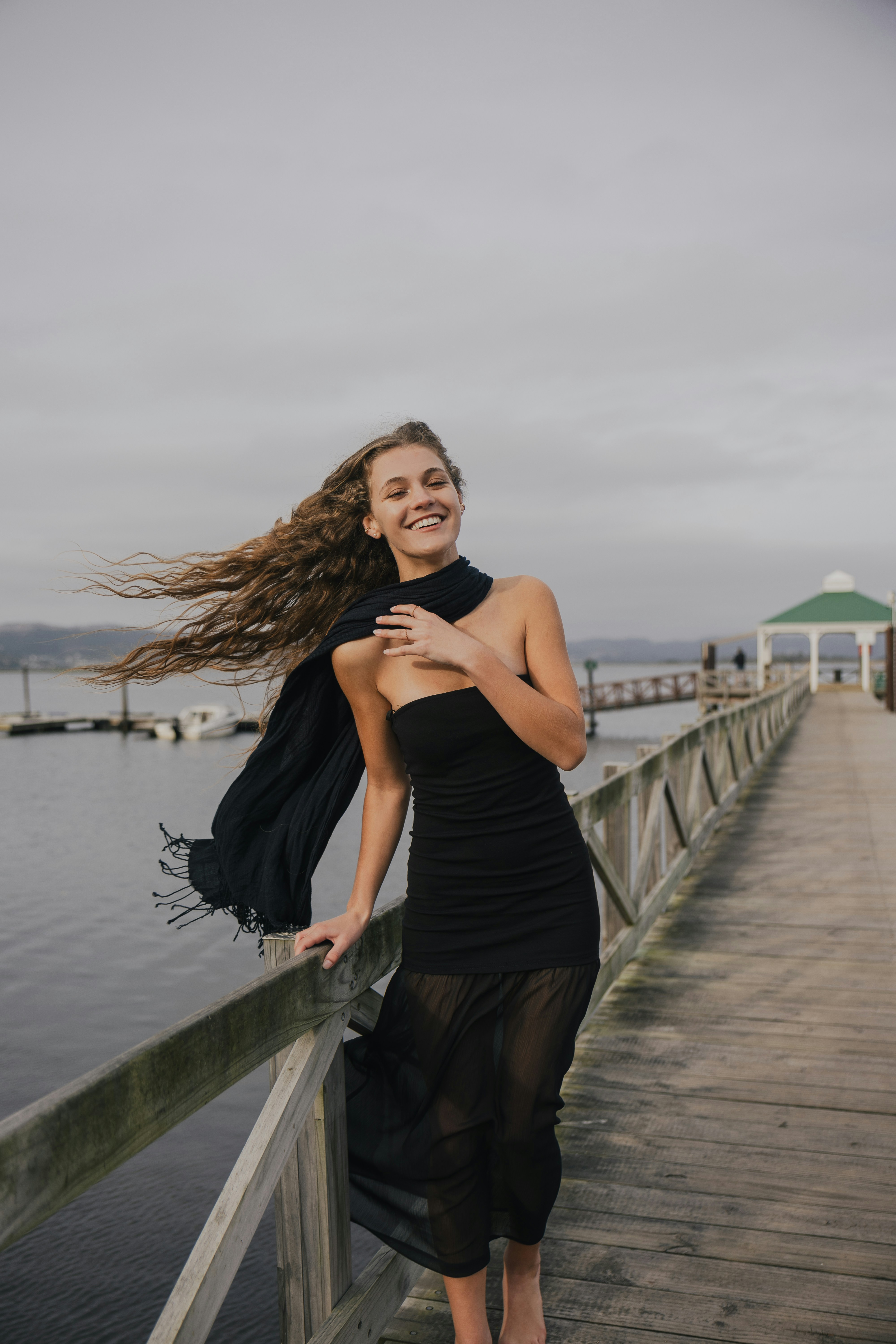 Grace on the Pier: A Silhouetted Smile by the Waterfront