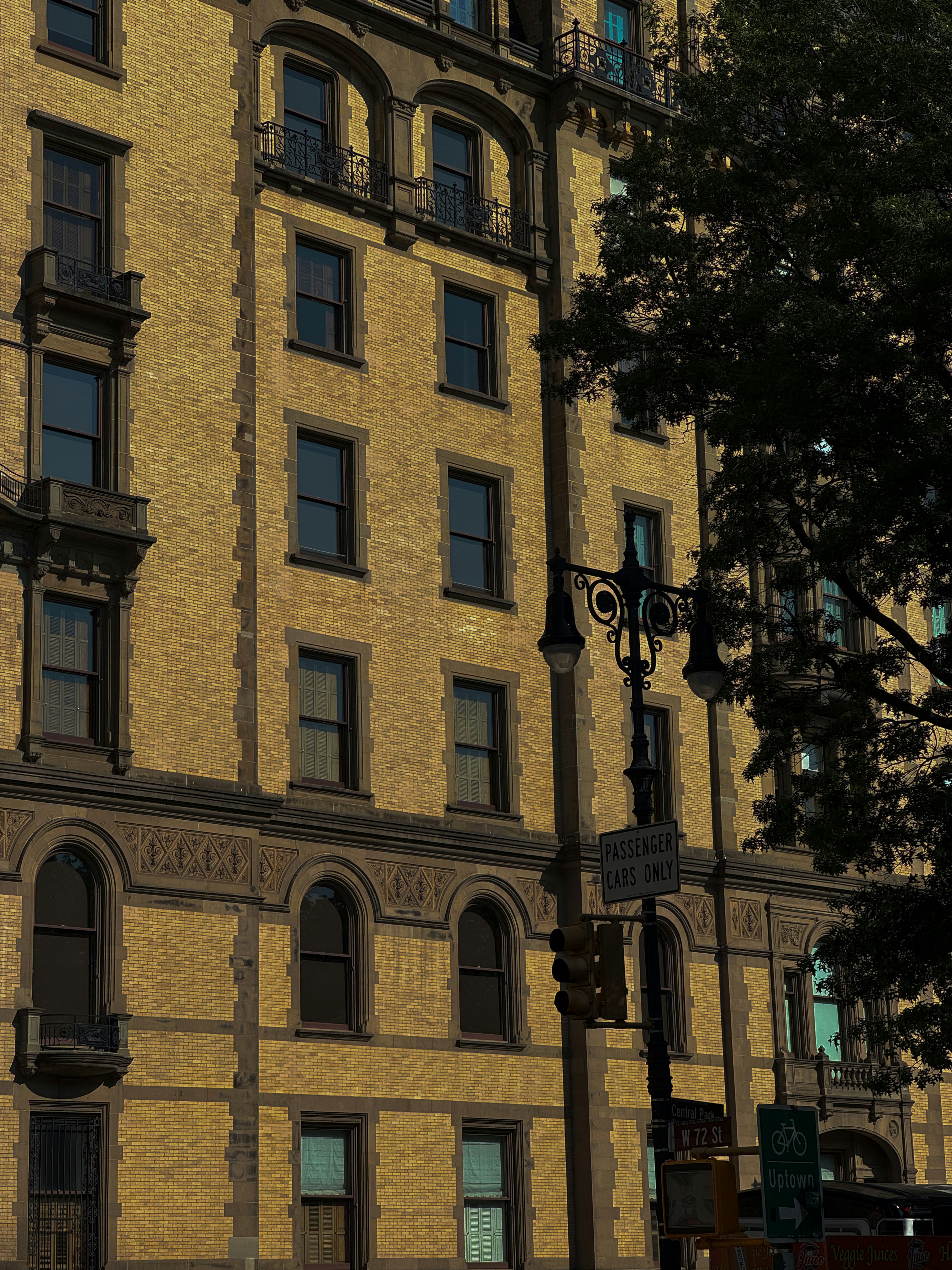 Sunlit Brick Facade and Ornate Street Lamp