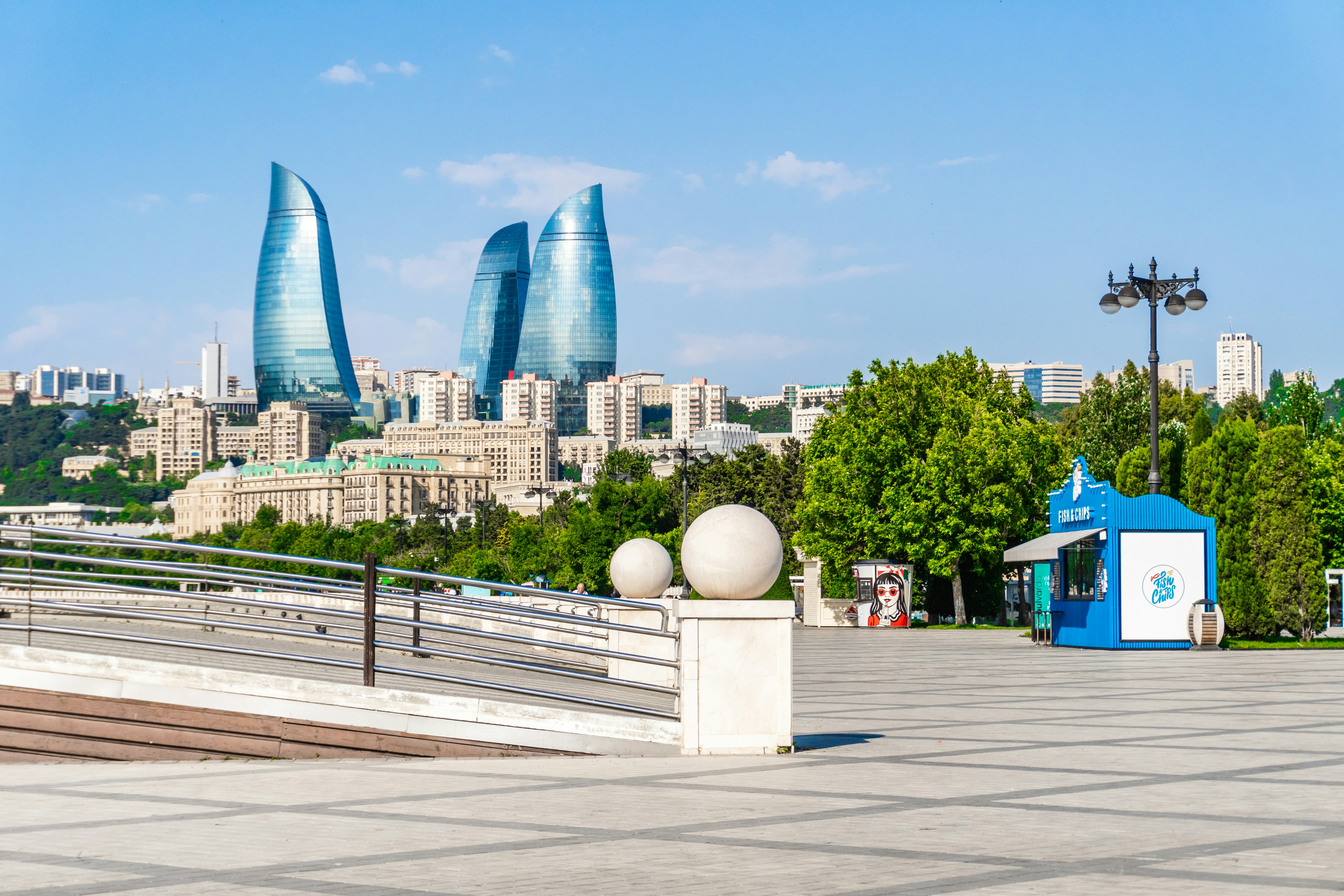 Blue-tinted Twin Towers over a Modern Waterfront