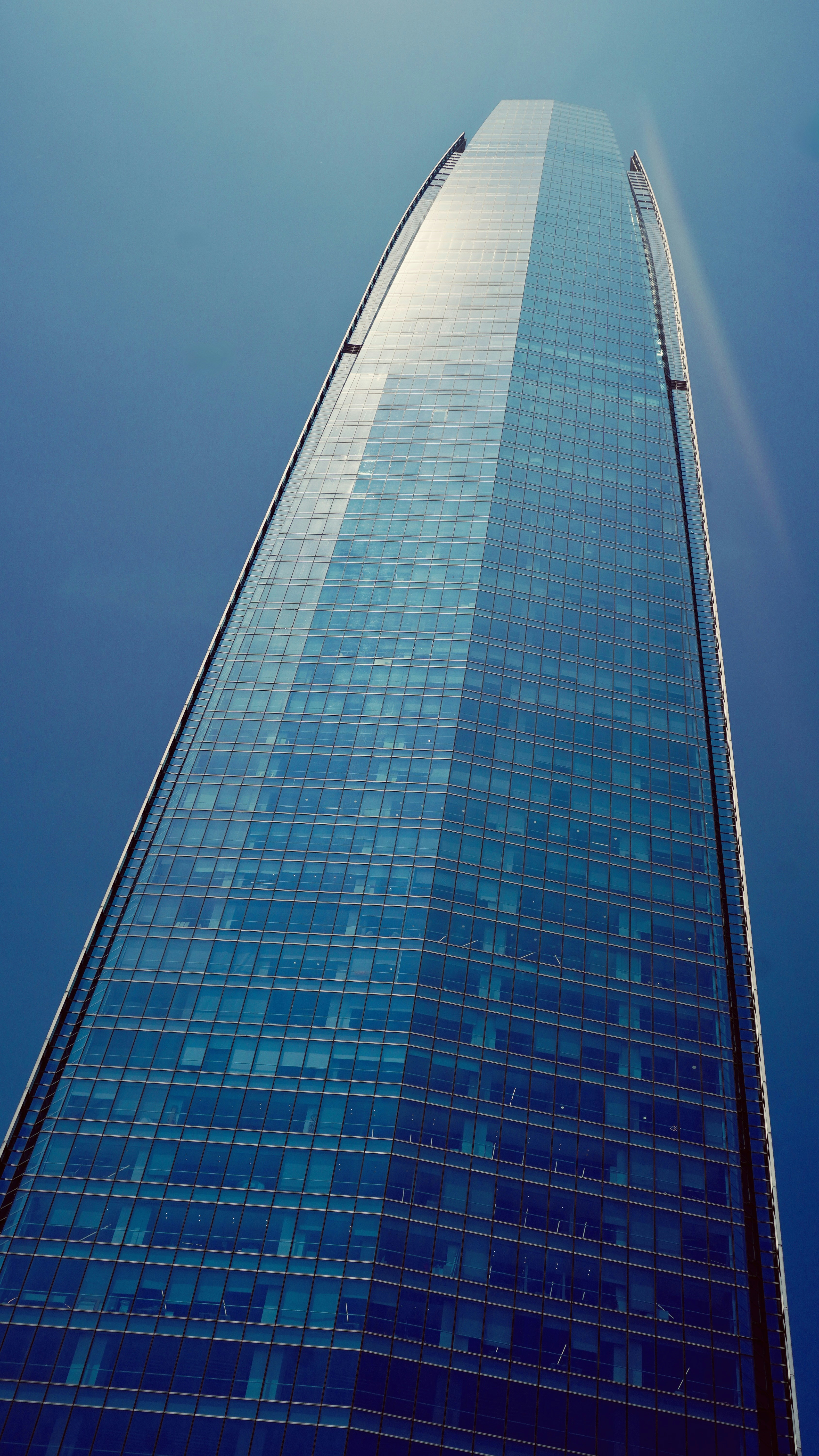 Apex of Glass: the Lean Blue Spine Reaching Skyward