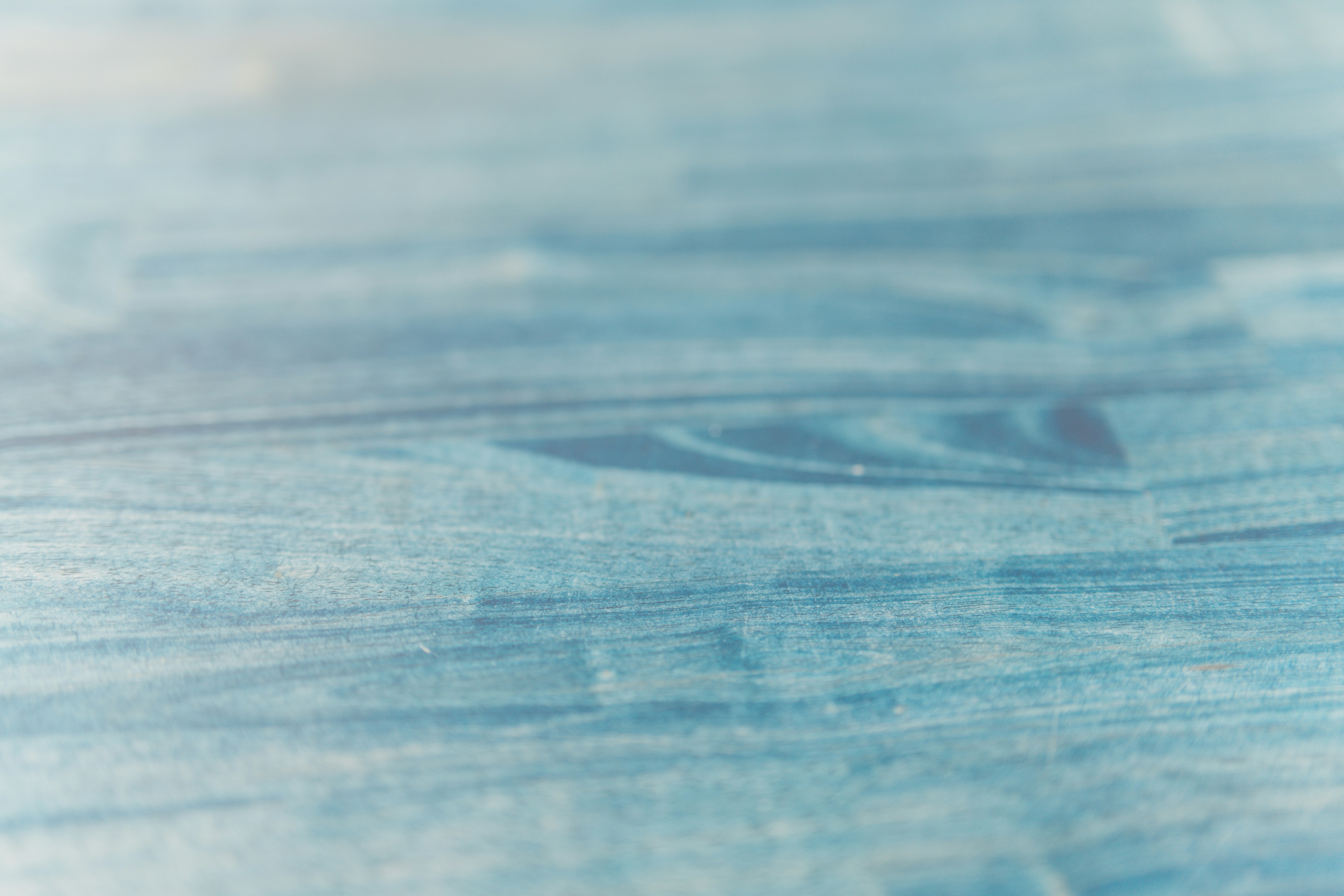 Weathered Blue: Subtle Grain on a Quiet Wooden Surface
