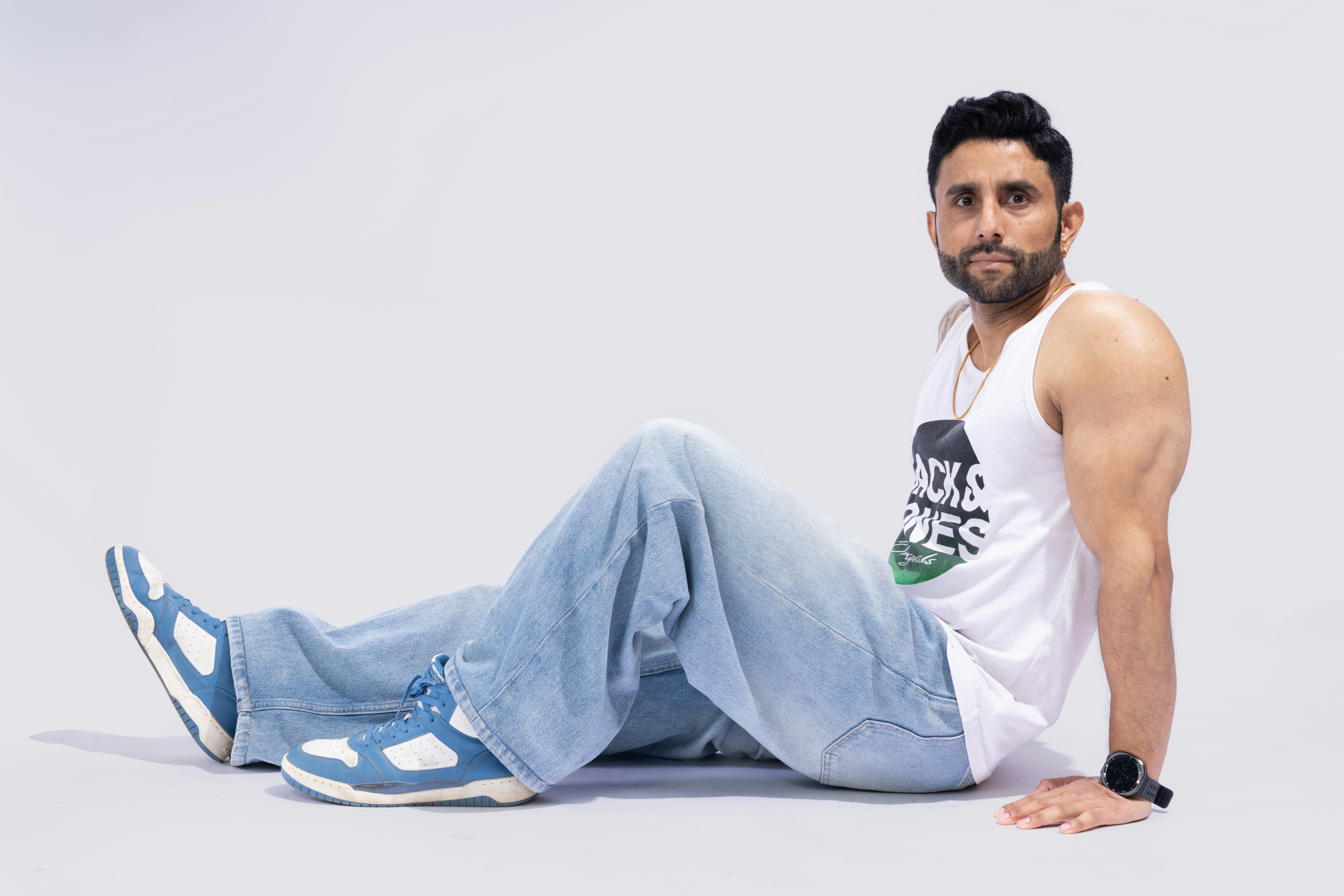 Casual Confidence: A Seated Portrait in Clean Studio Light