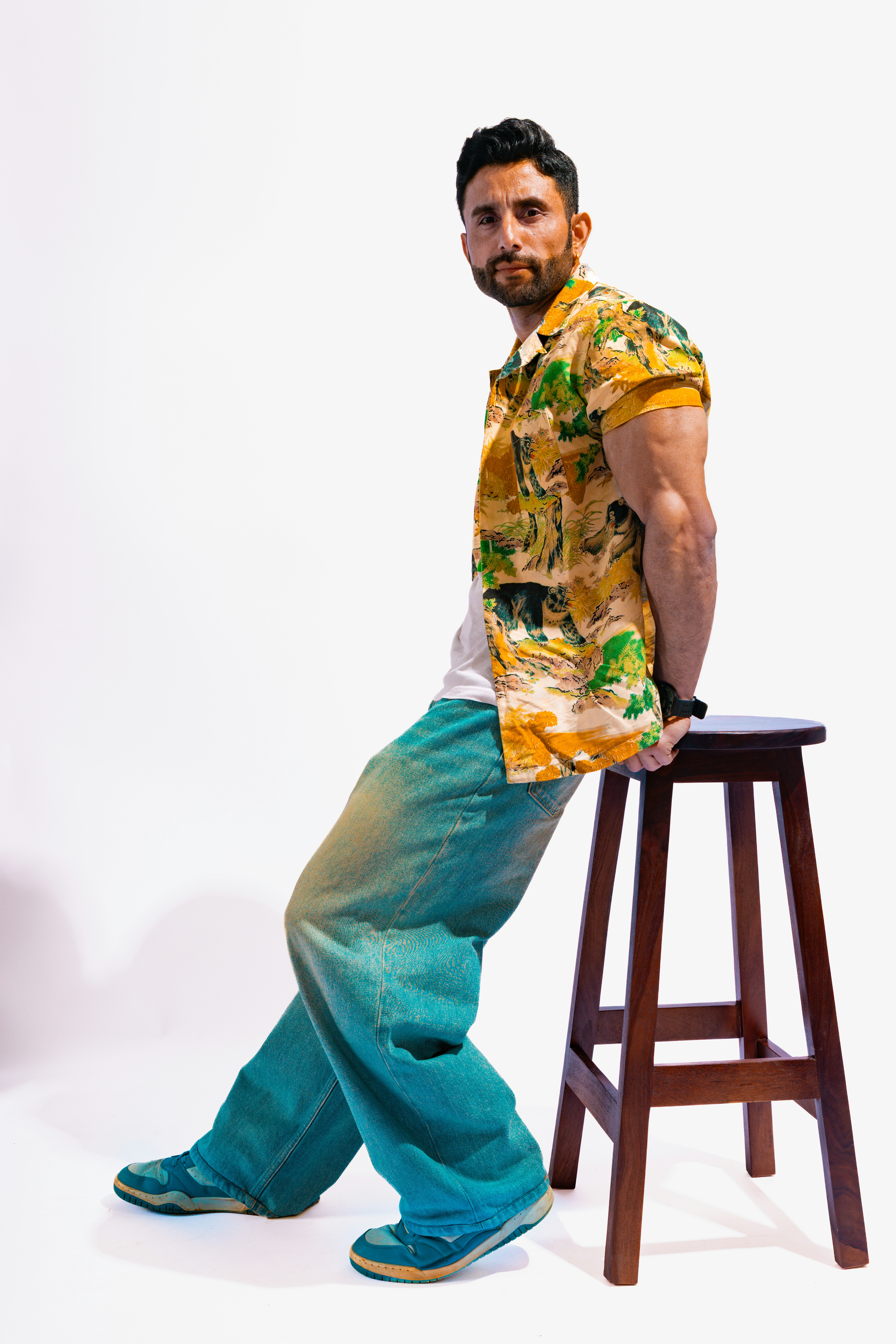 Leaned-back Confidence: A Casual Charleston Against a Studio White