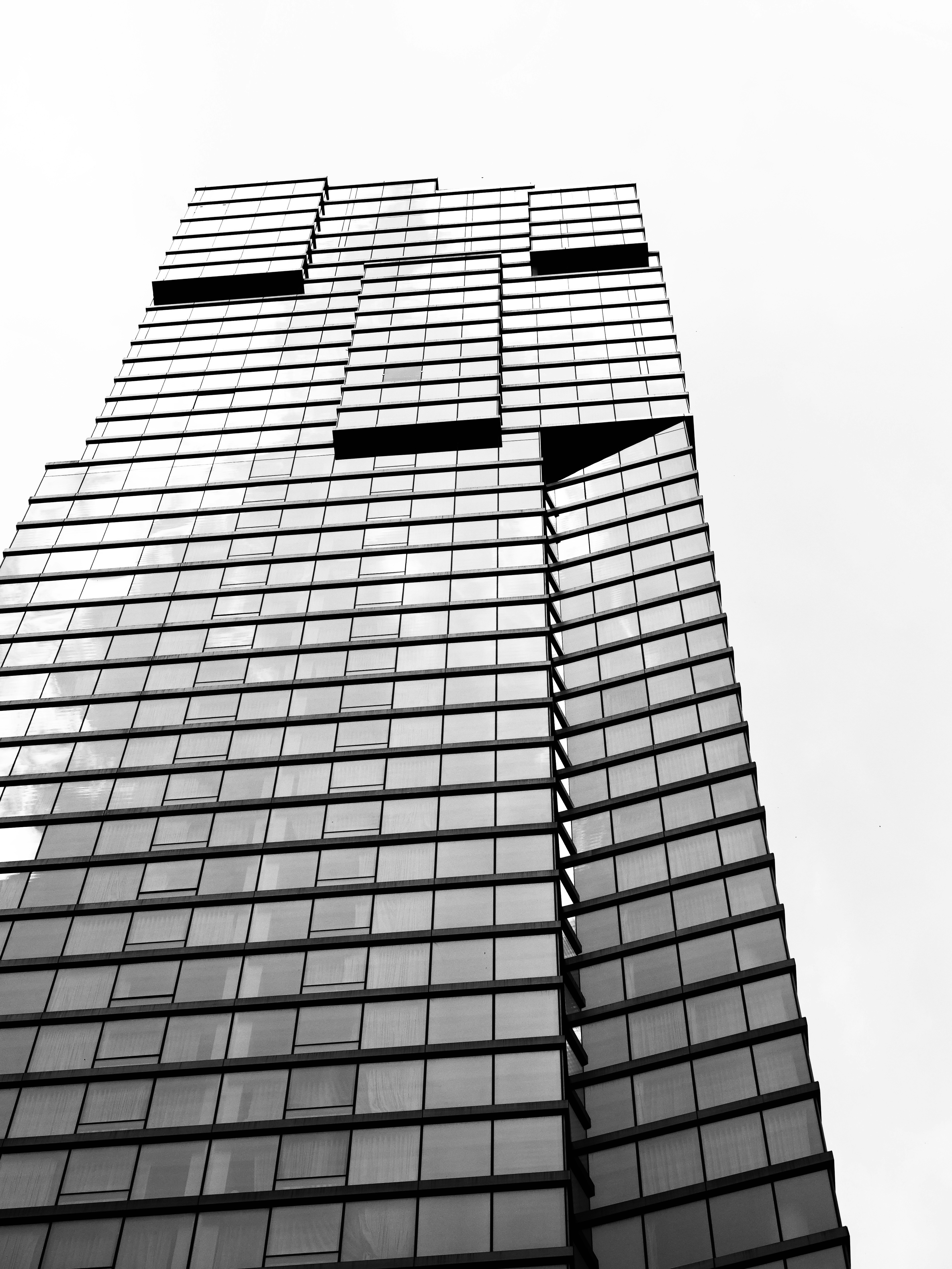 Vertical Grid: A Modern Glass Facade Reaching the Sky