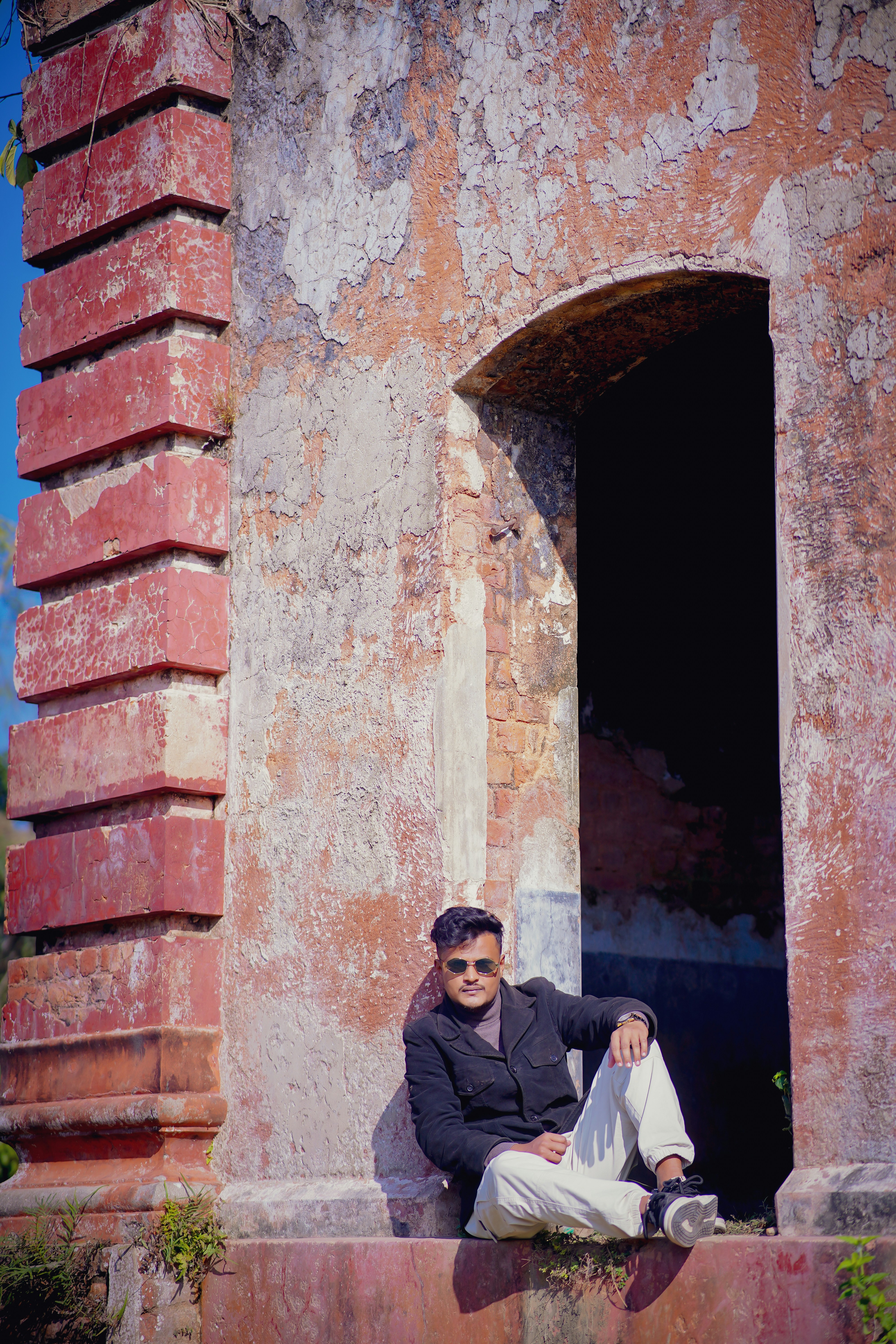 Lonely Gatekeeper: Man in Shadowed Archway