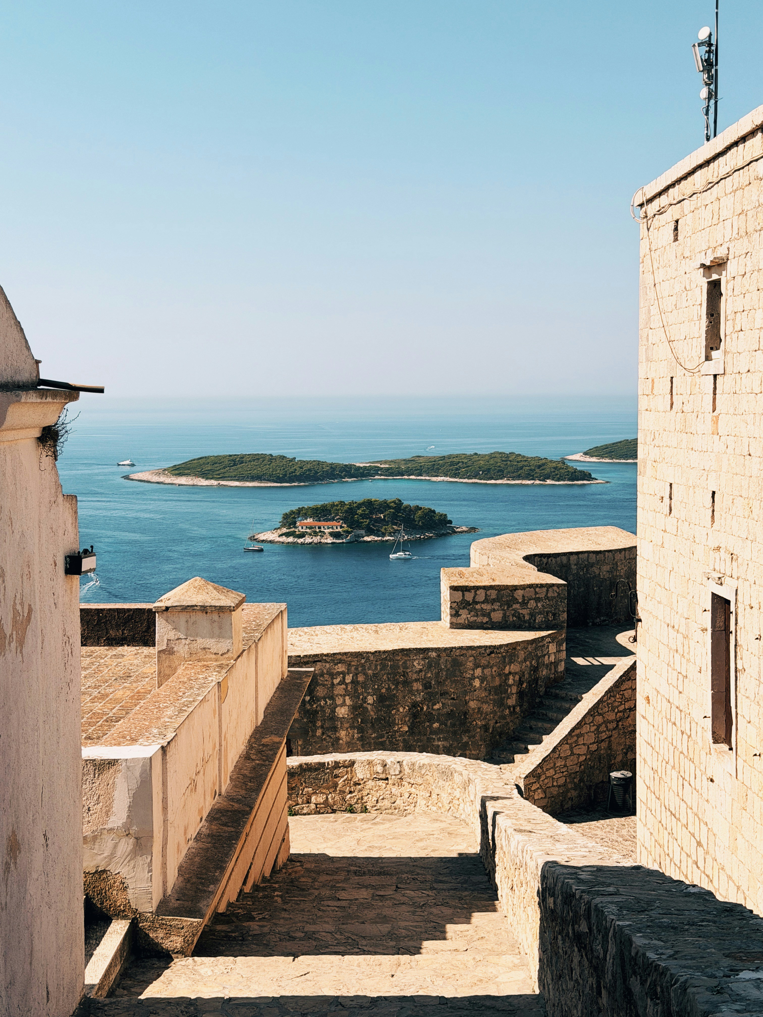 Sunlit stone steps to the sea: a Mediterranean vantage