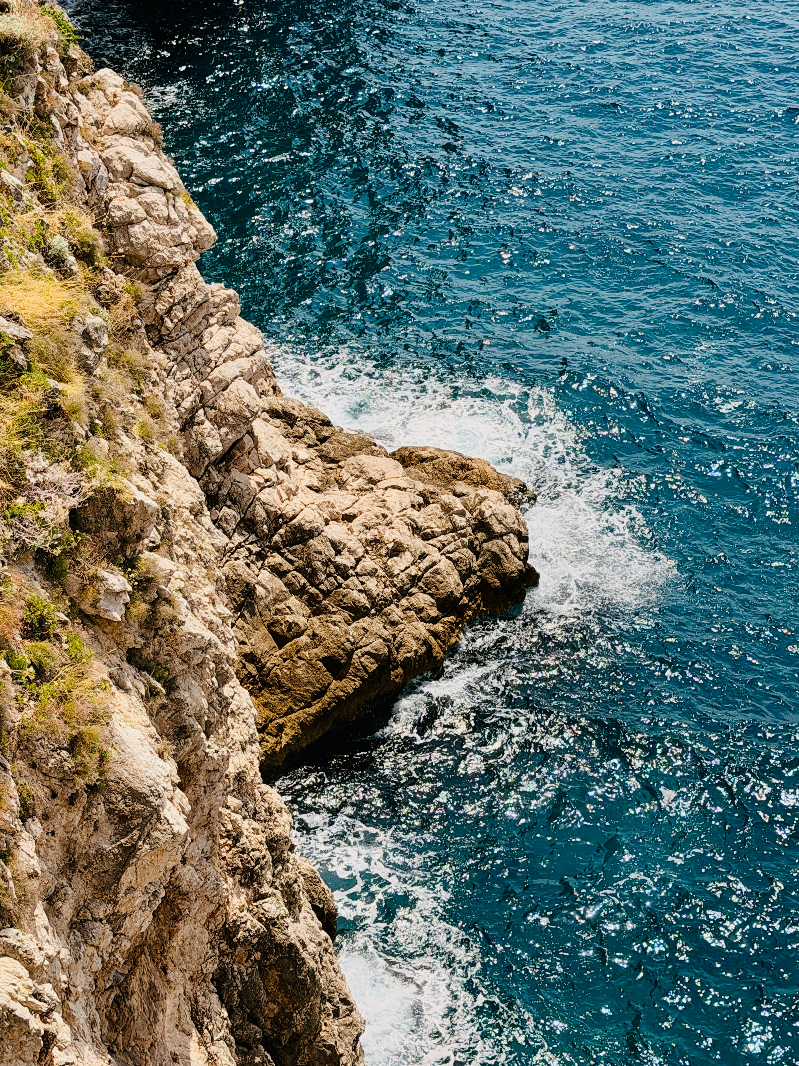 Cliff Edge Meets the Sea: A Bold Cobalt Break