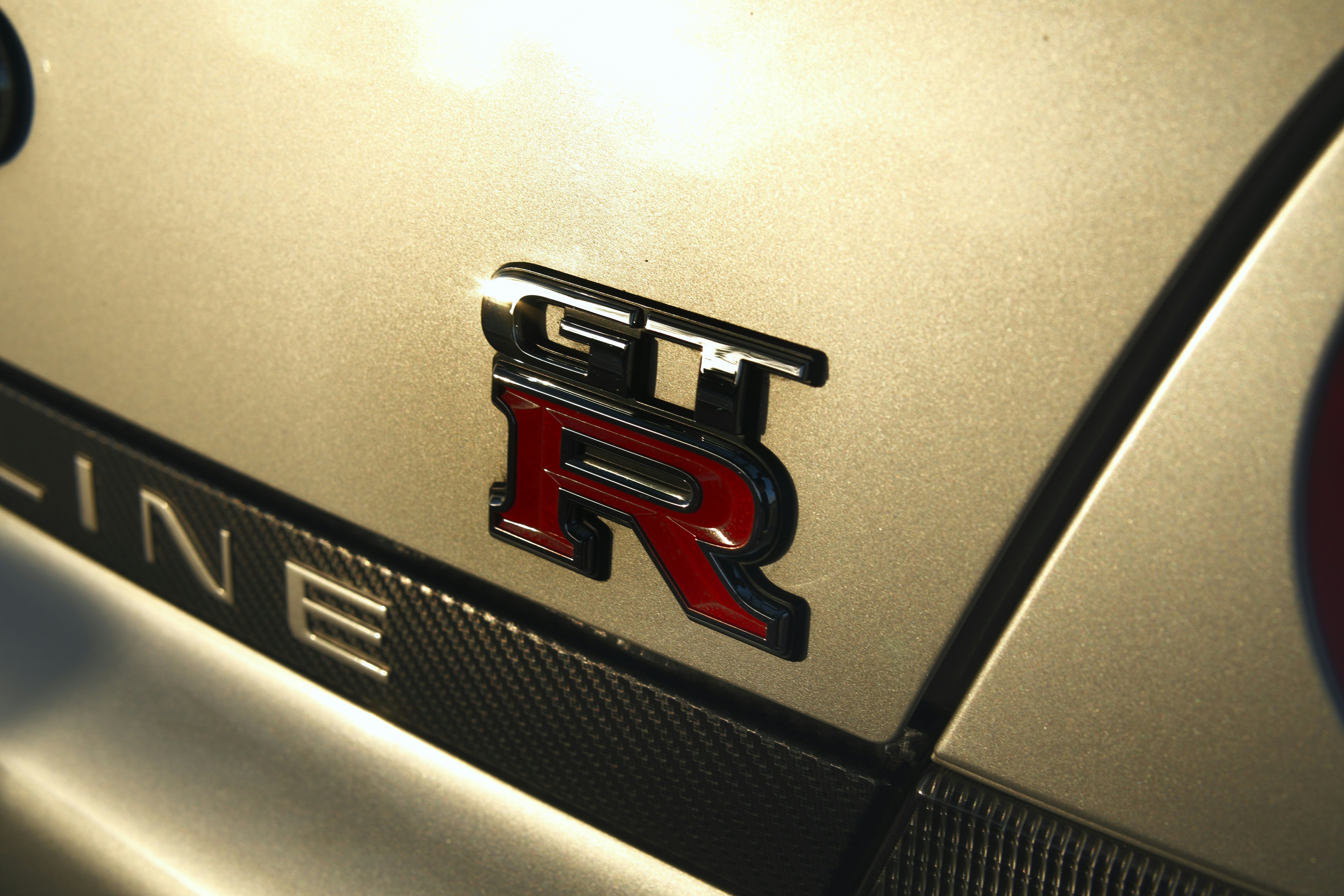 Turbocharged badge on metallic midnight blue trunk