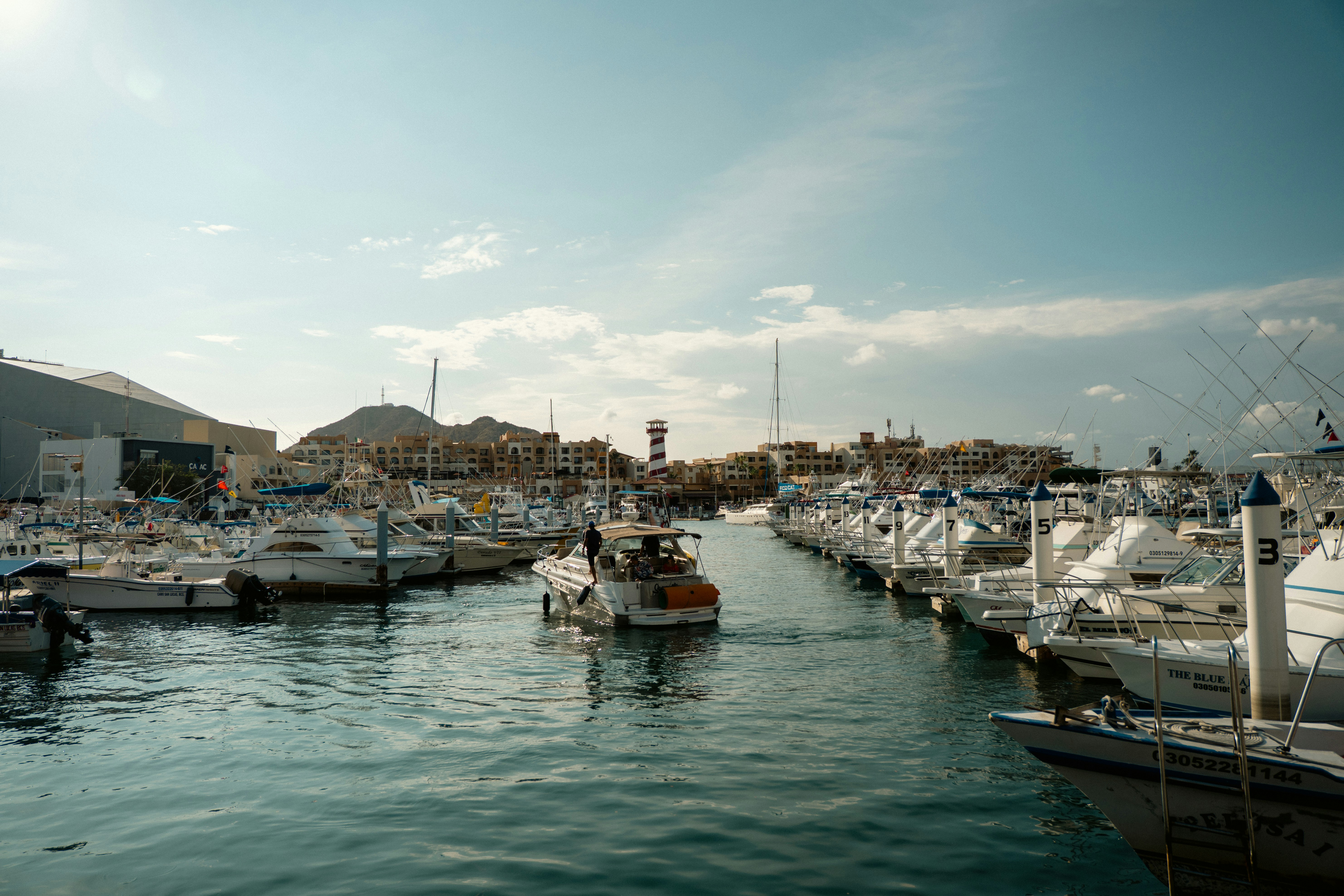 Harbor Symmetry: Boats Docked in a Quiet Coastal Channel