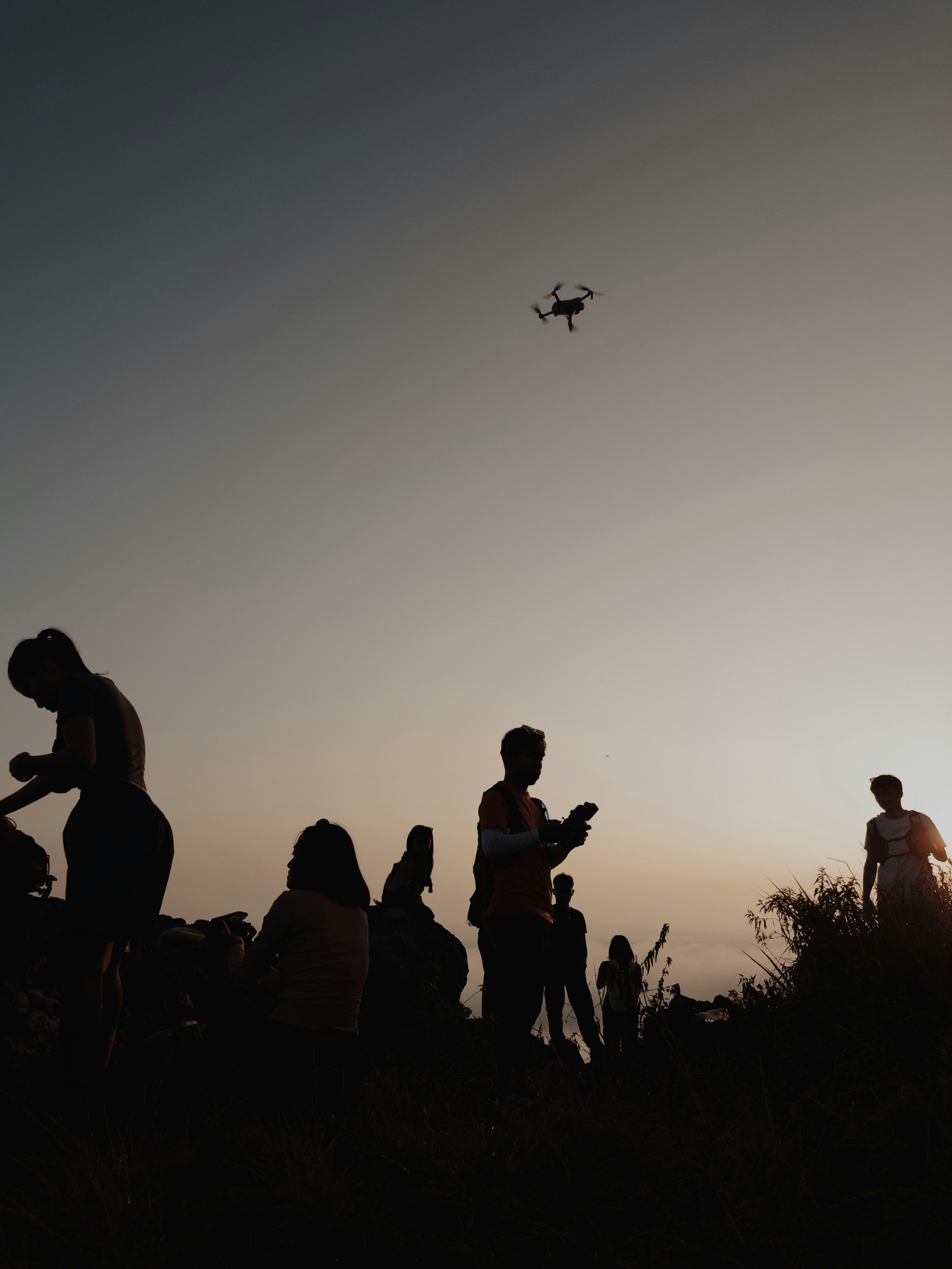 Dusk Drone Above a Quiet Crowd
