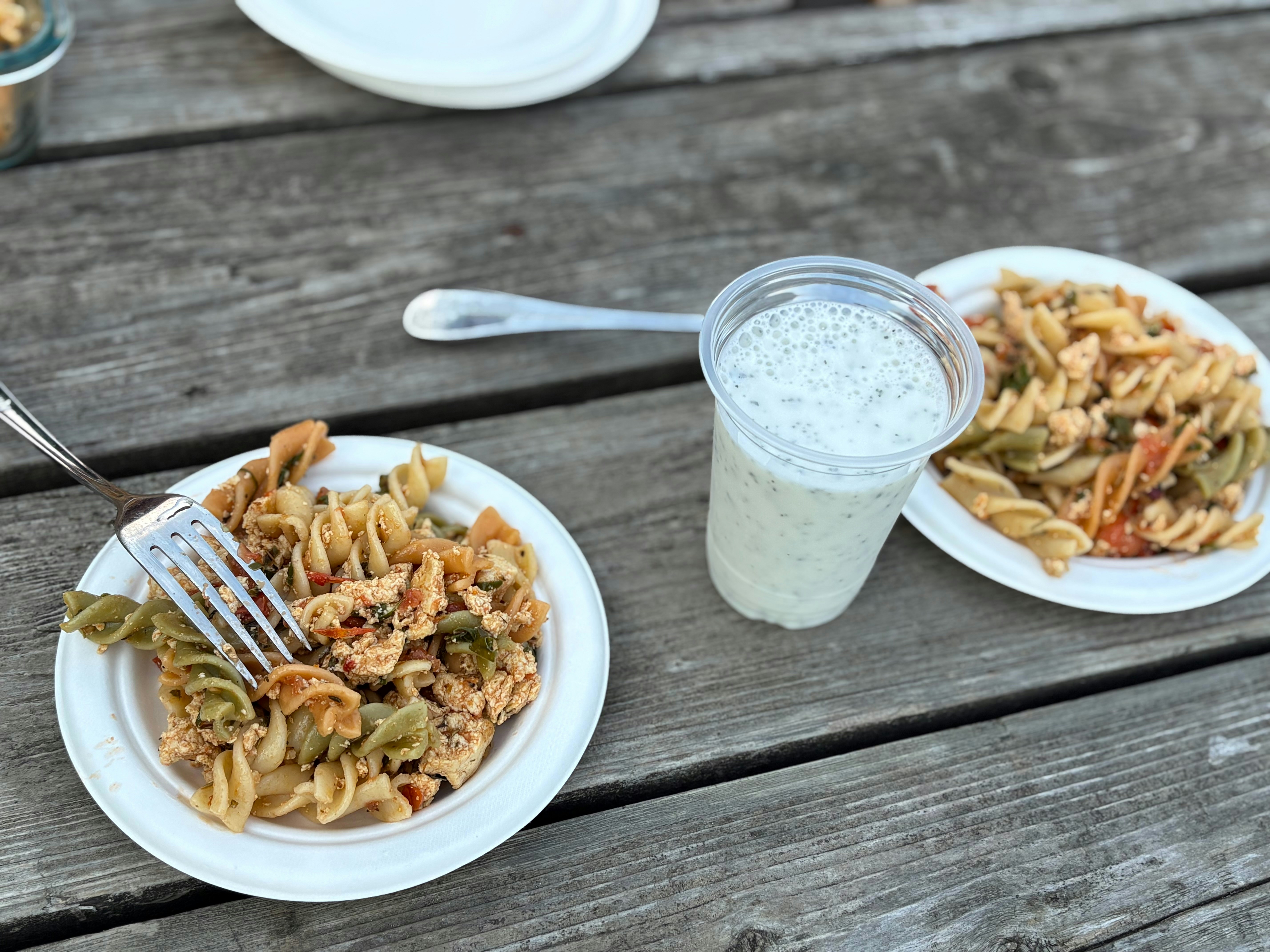 Two Plates, One Milkshake: A Rustic Pasta Lunch on Weathered Wood
