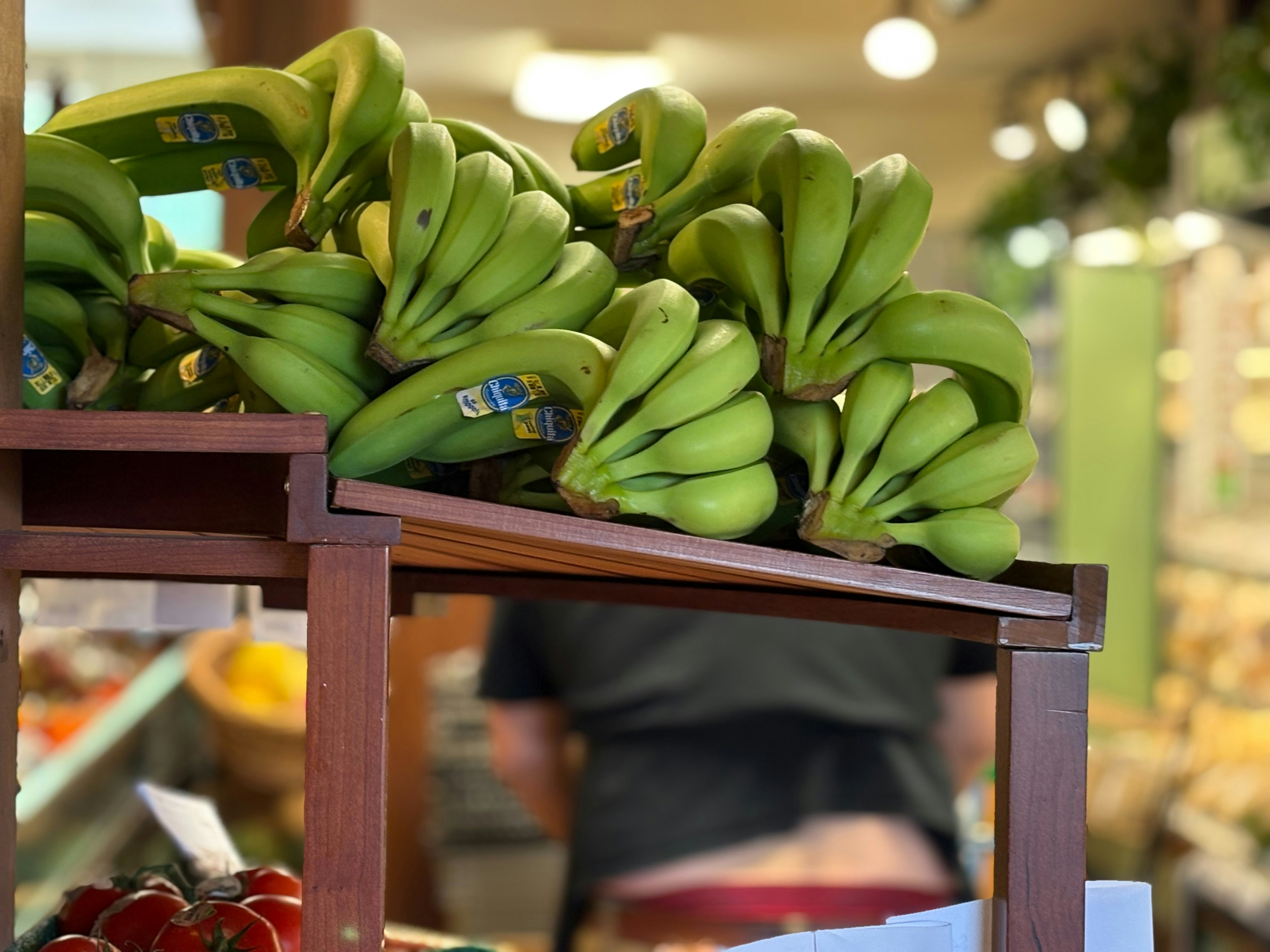 Banana Bunches Framing a Florid Market Scene