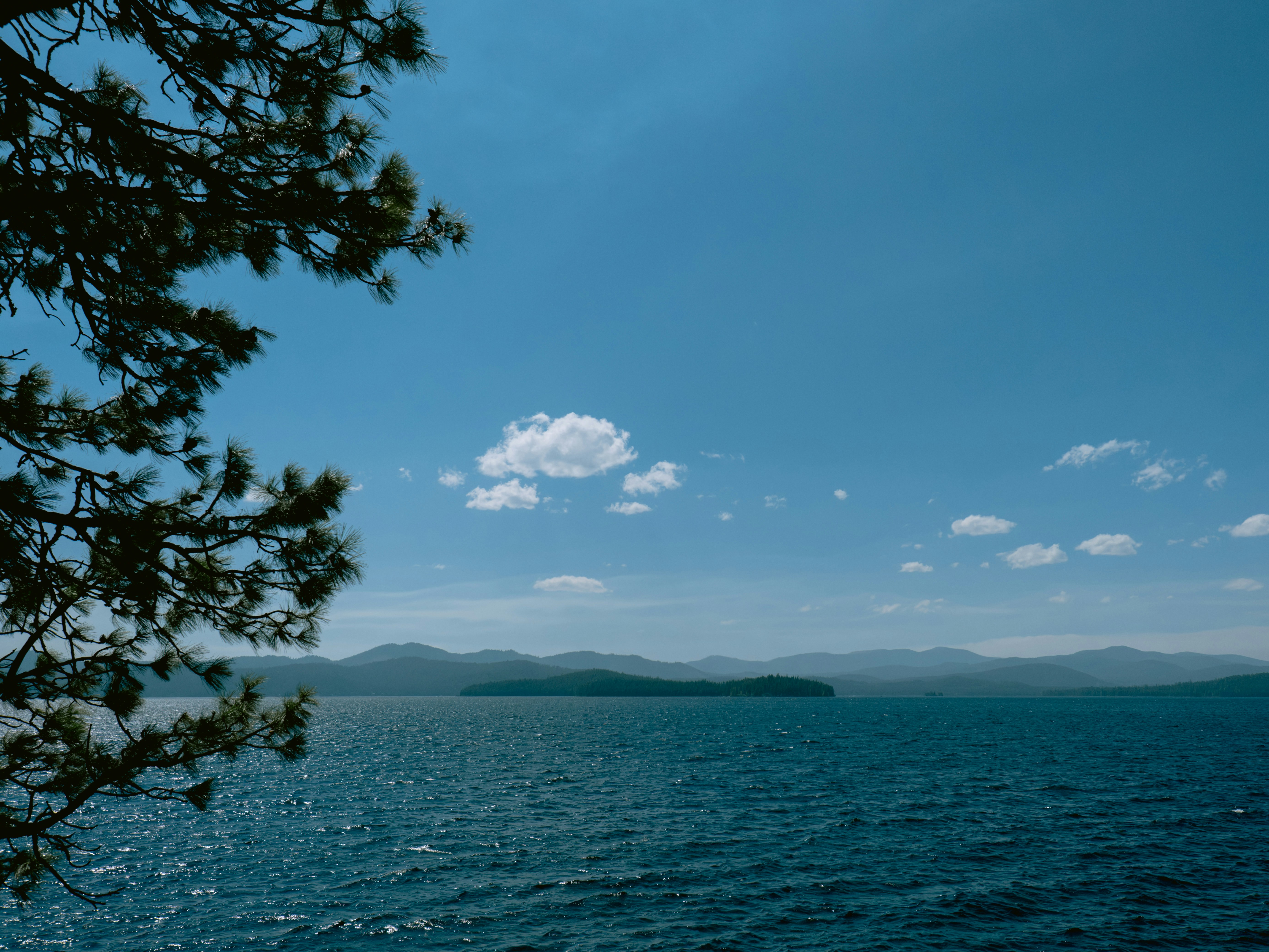 Azure Horizon: A Quiet Lake Beneath Open Skies