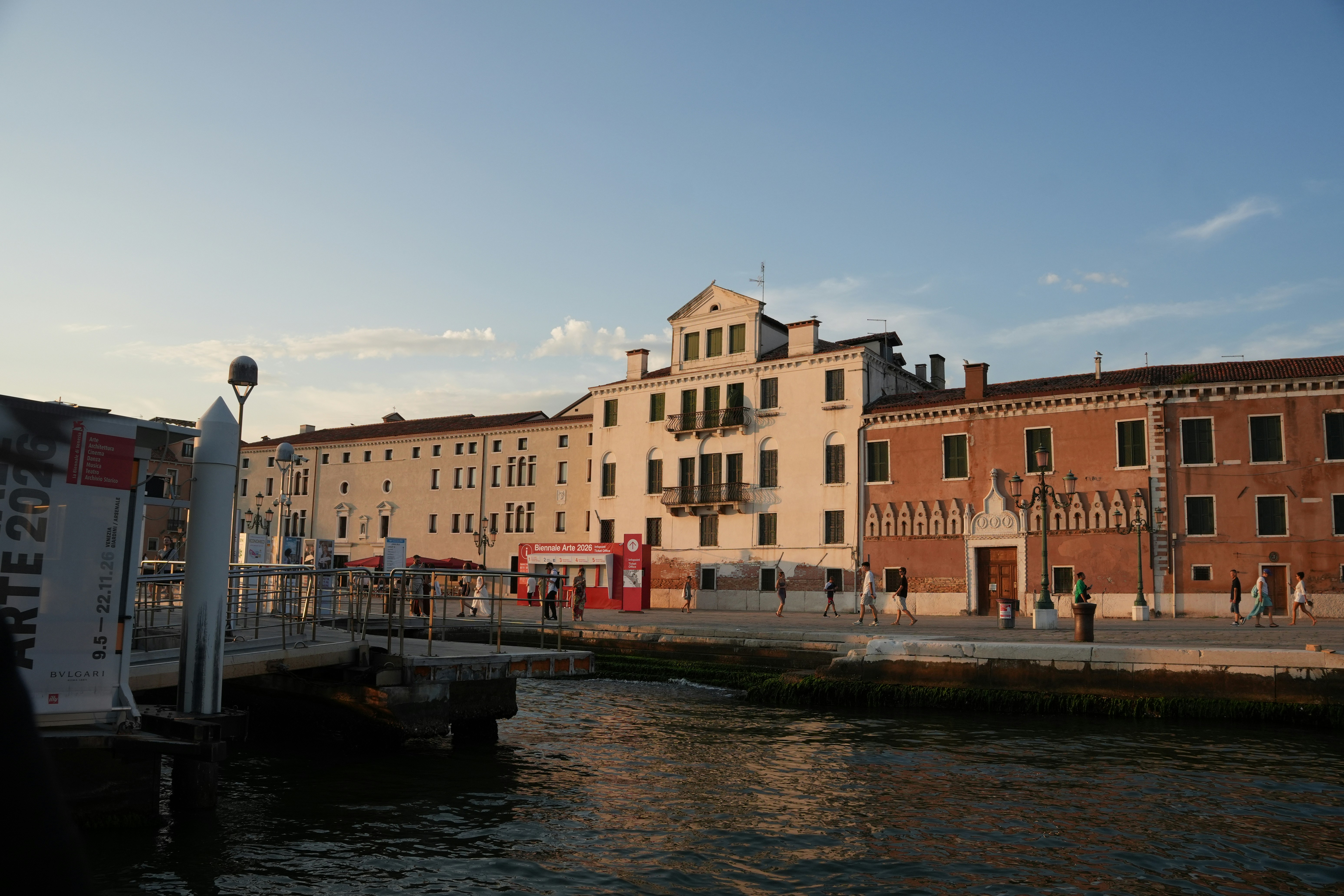 Harborfront Facades: Sunlit Row Along the Water