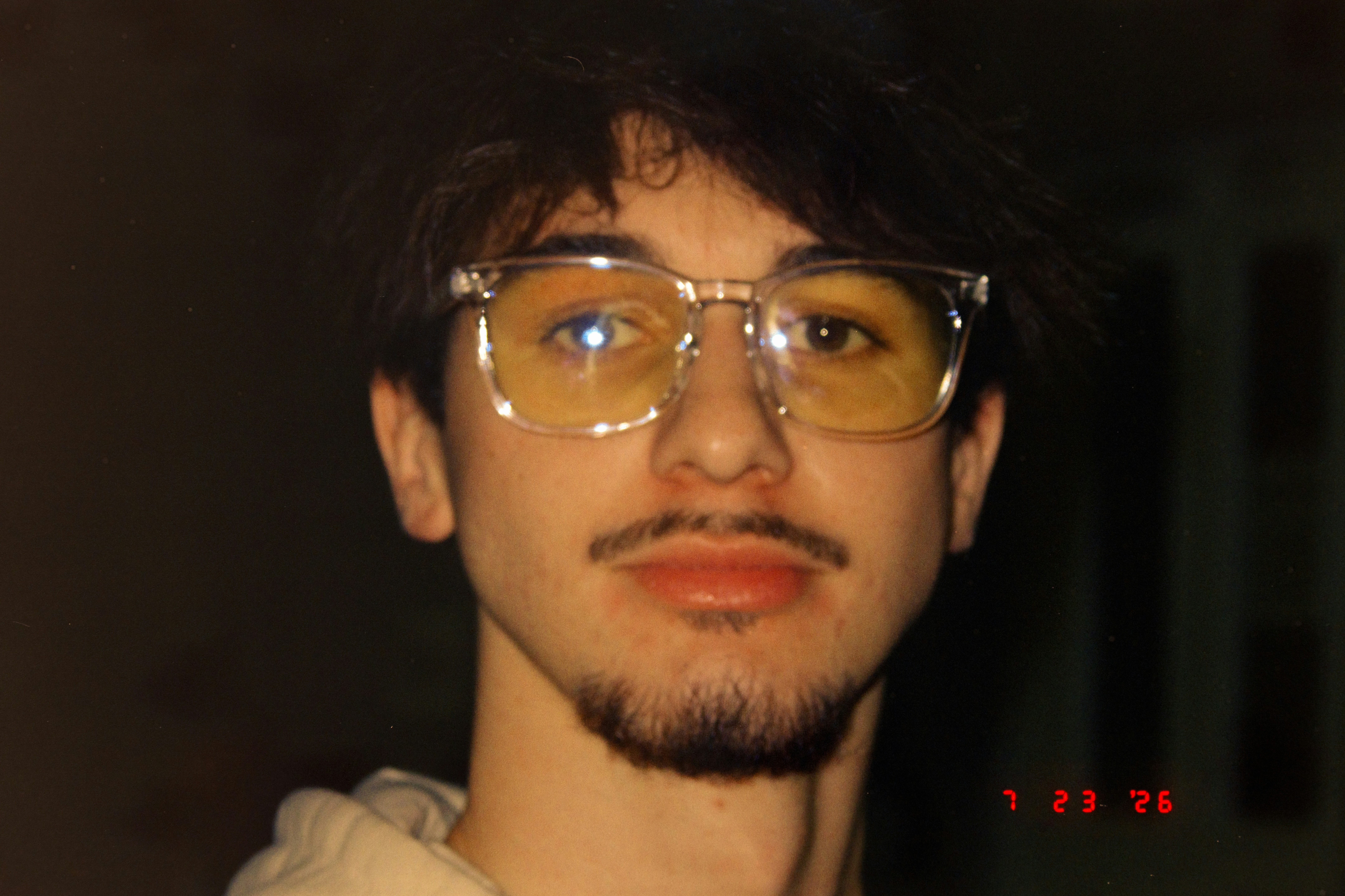 Glasses and Gaze: A Night Photo of a Young Portrait