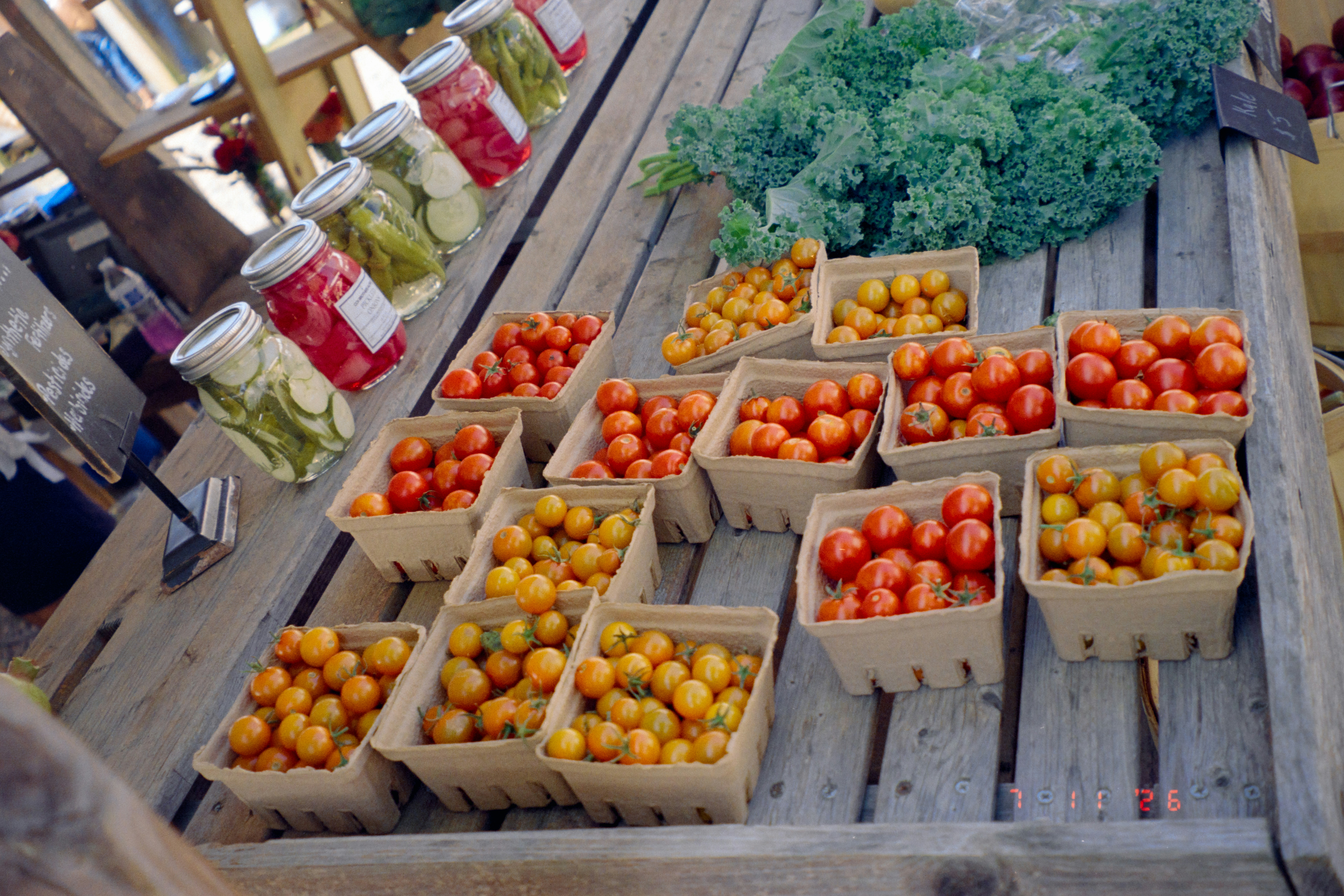 Crate-lined Market Treasures: Tomato baskets on weathered boards