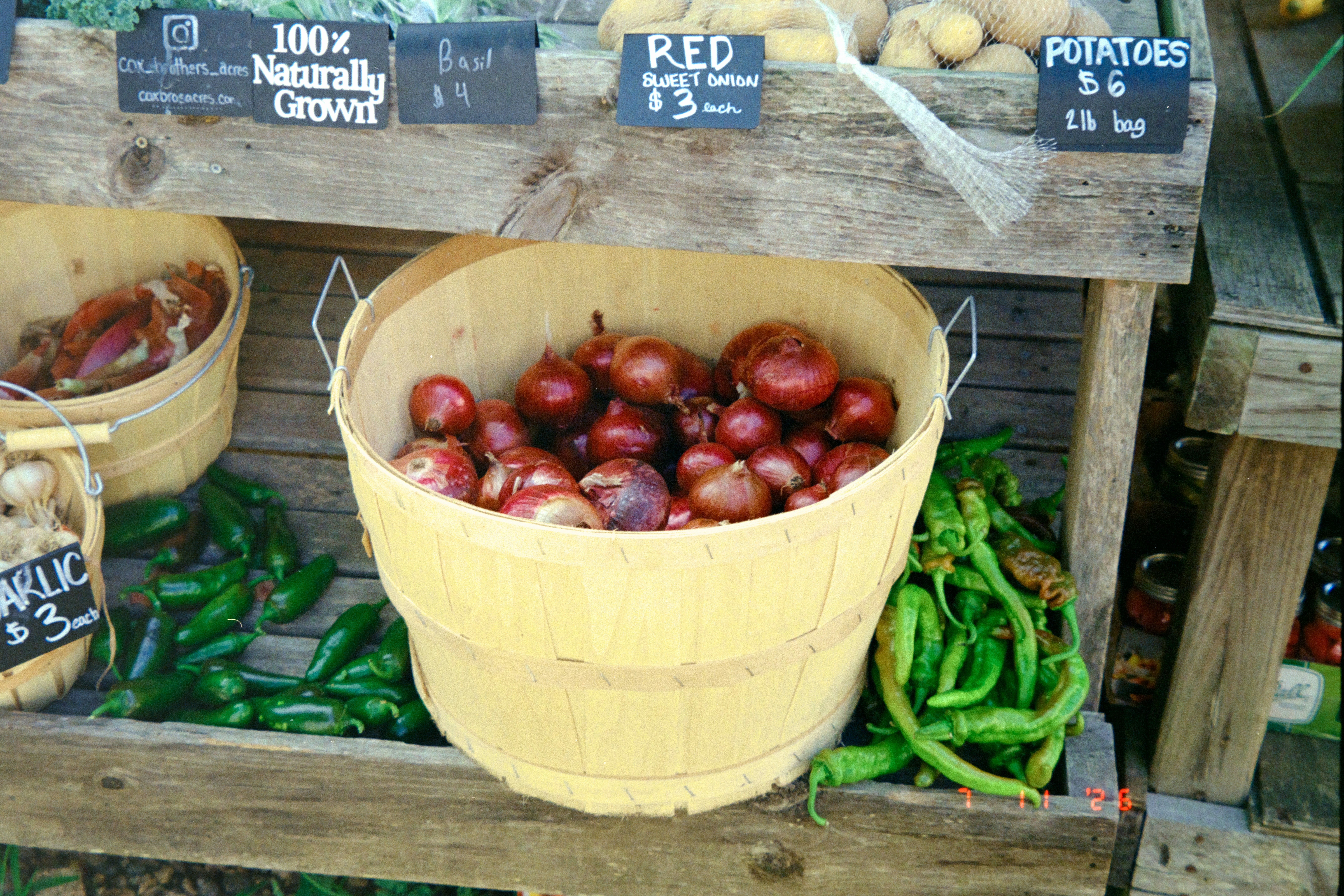 Basket of Red Nectar Apples at a Rustic Market Stand