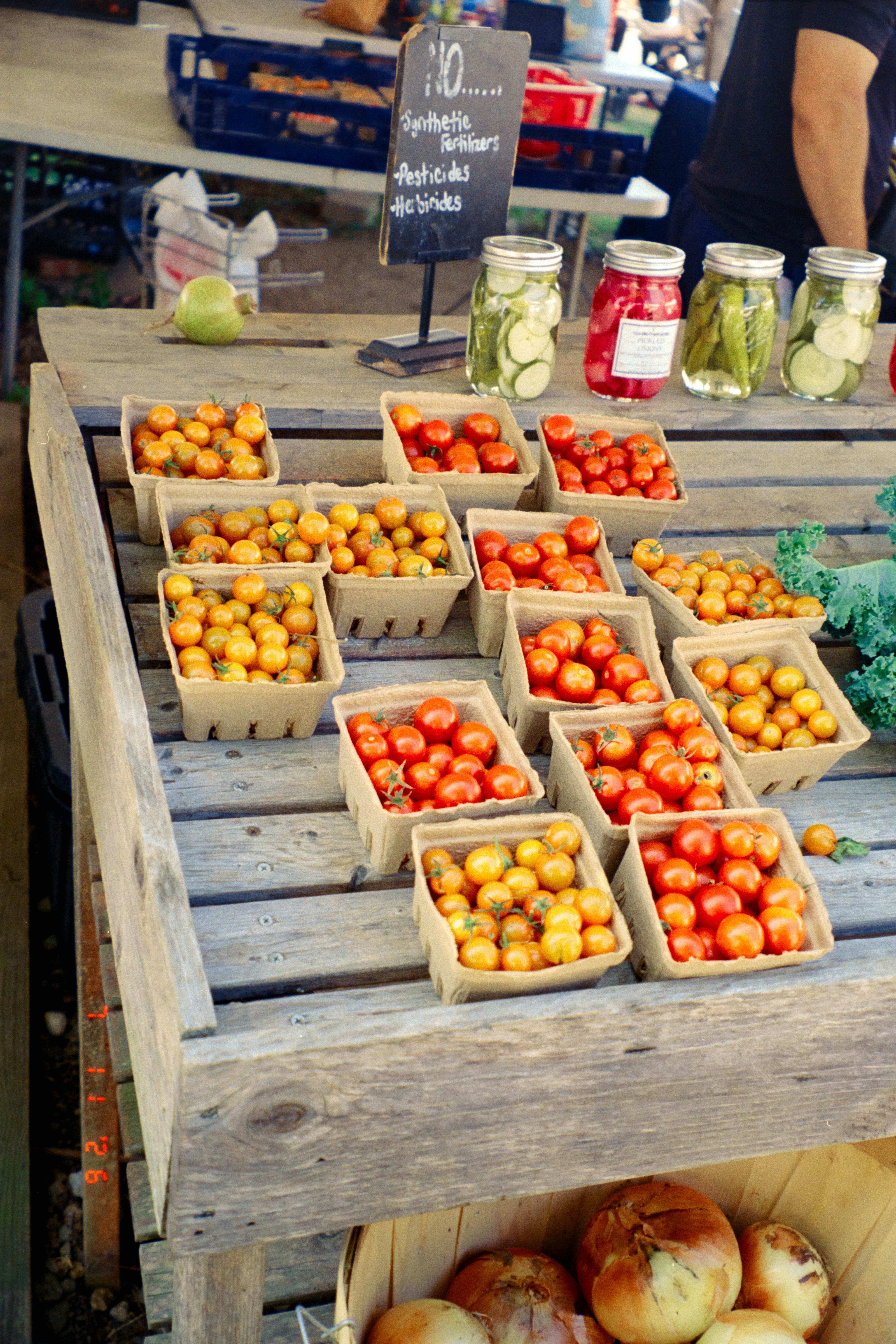 Basketed Harvest: Cherry Tomatoes at a Rustic Market Stand