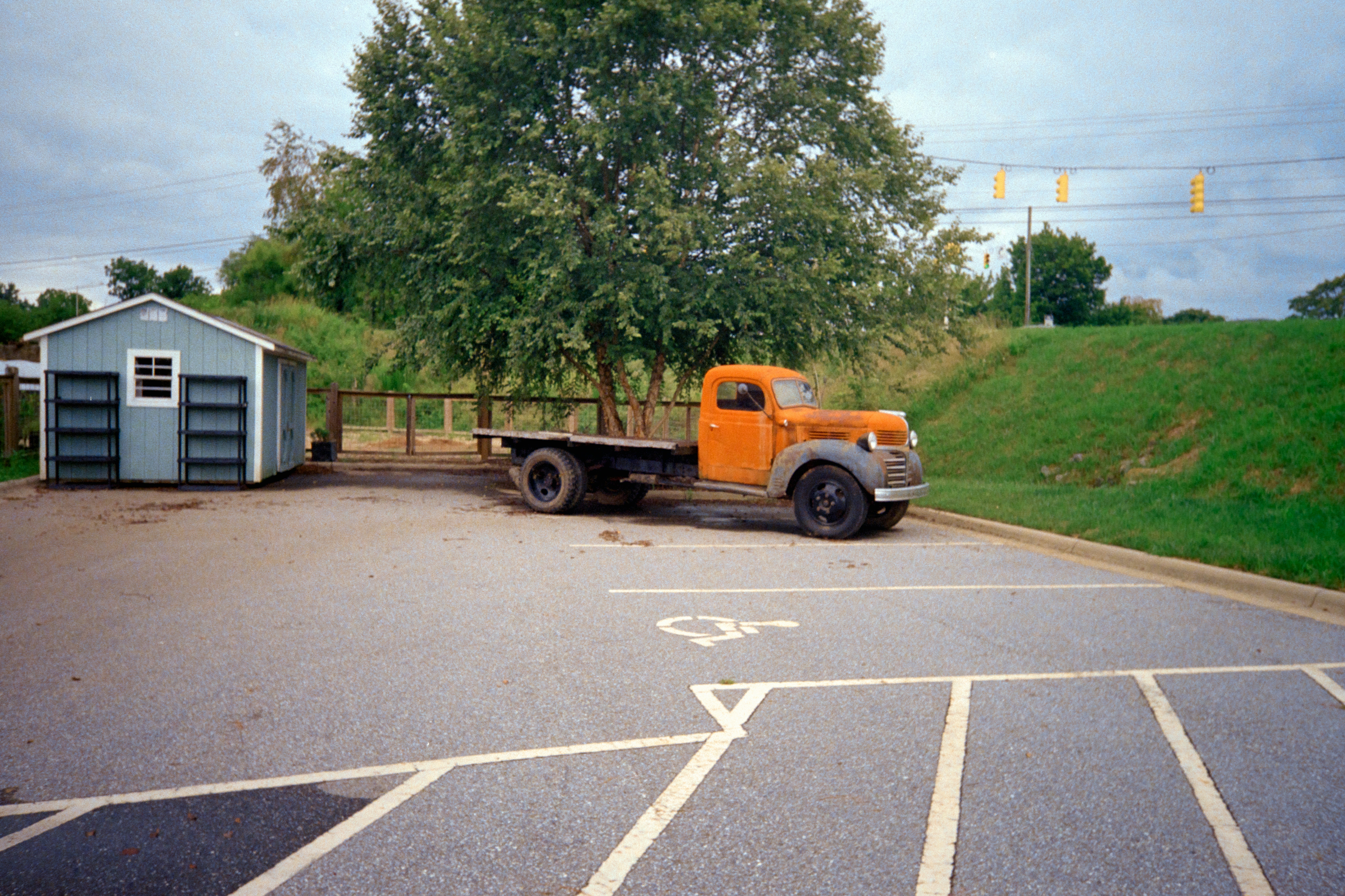Old Utility Truck Resting by the Quiet Parking Lot