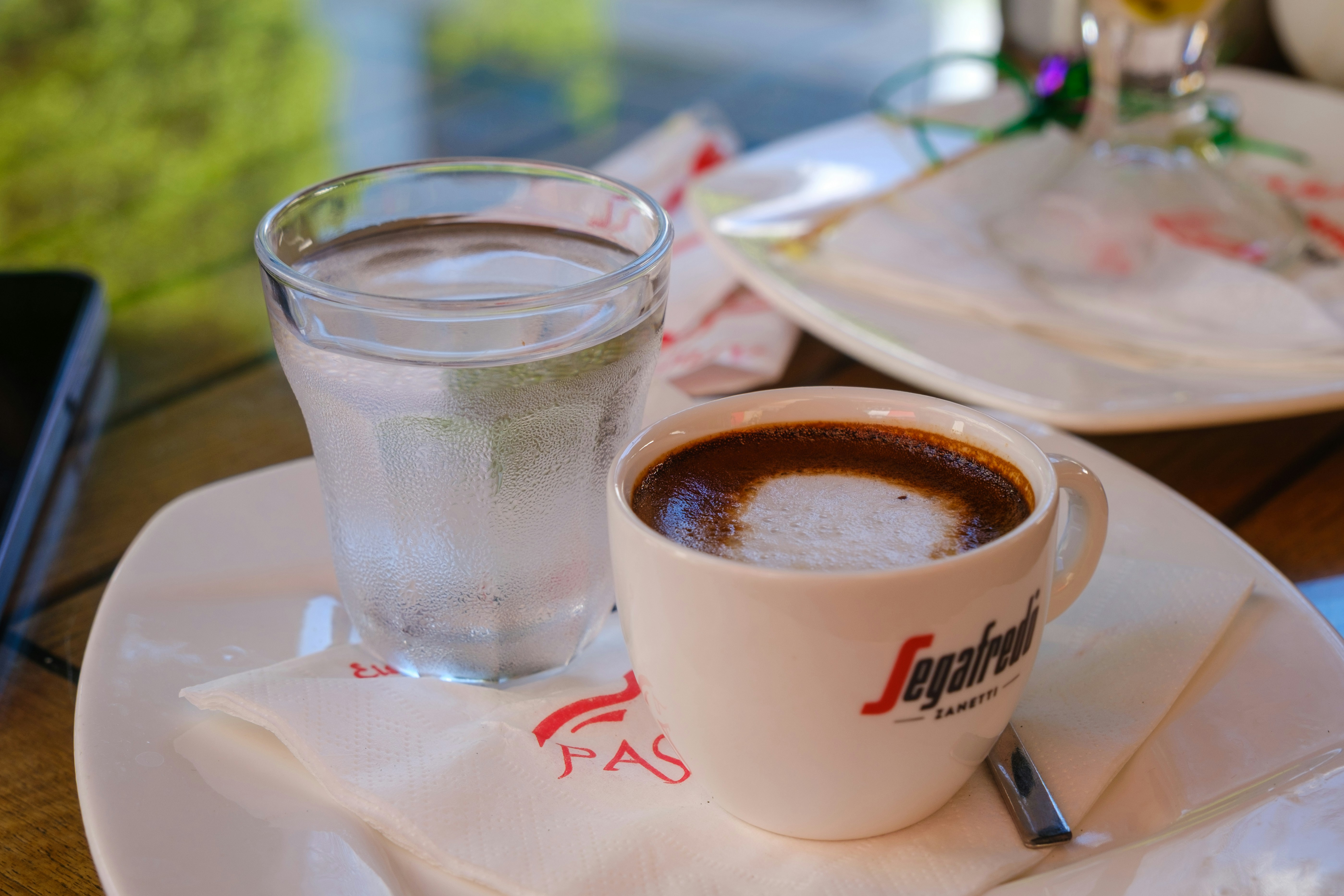 Coffee in Focus: A Quiet Café Moment with a Creamy Cappuccino