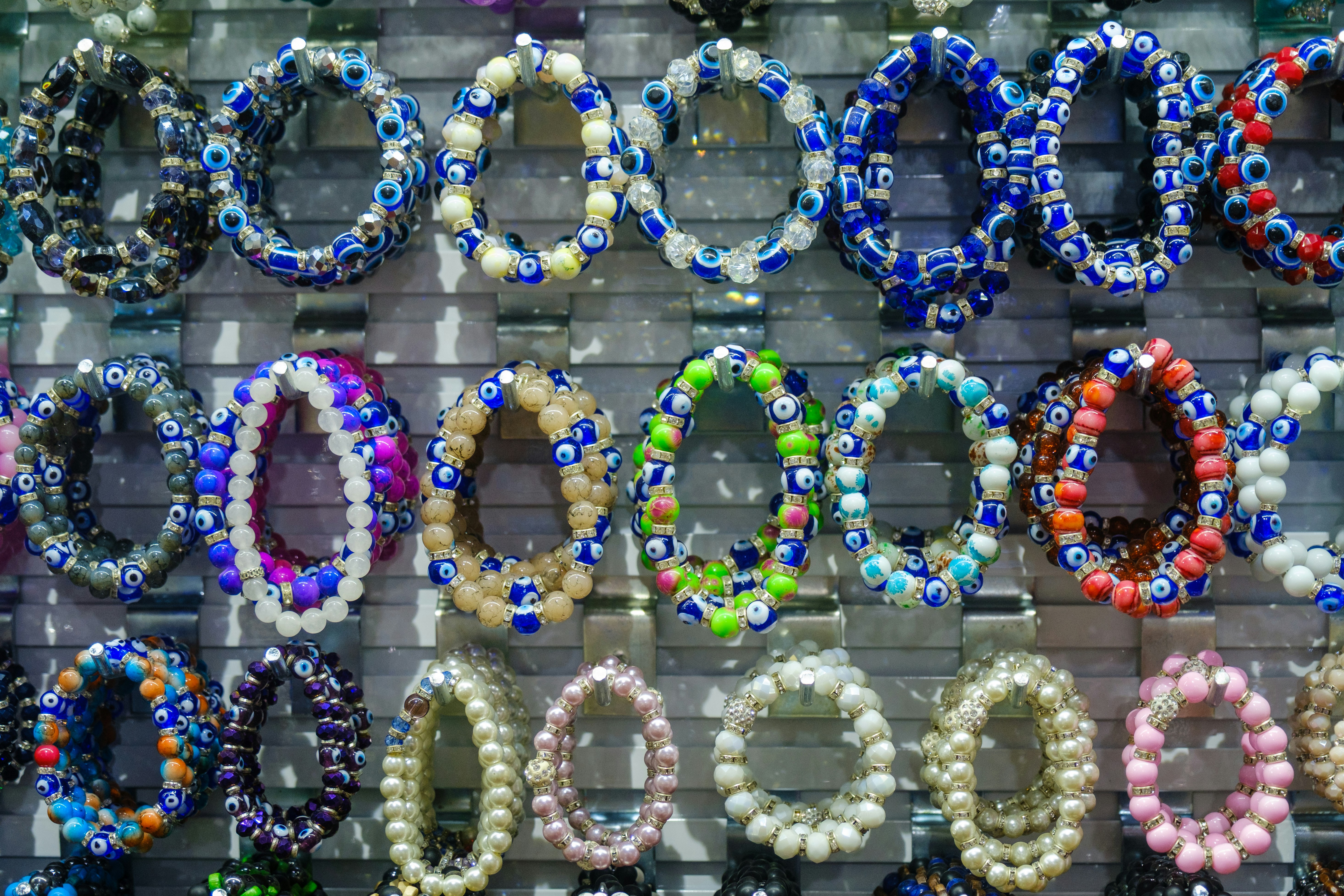 Beaded Rings in a Rainbow Grid